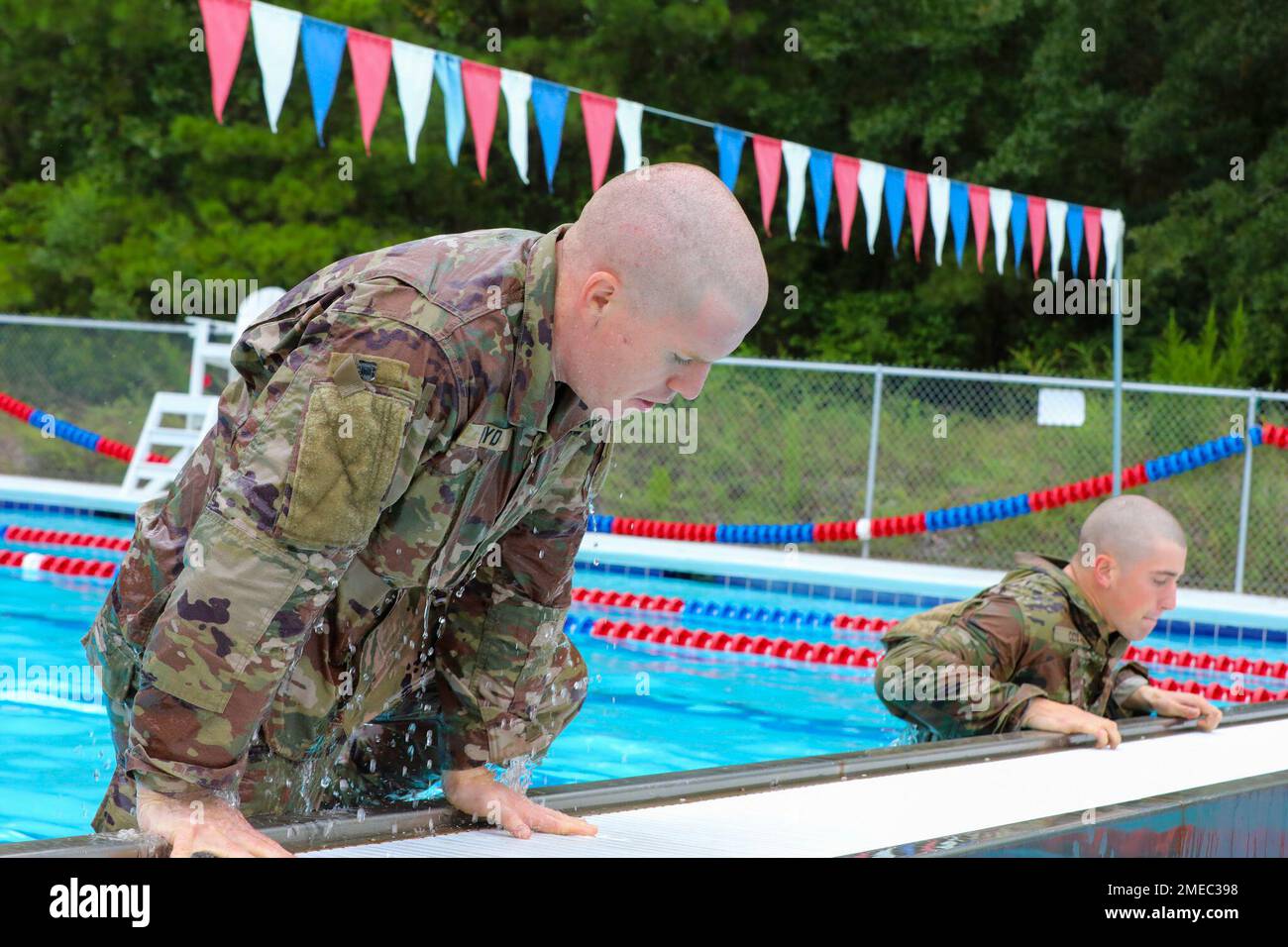 Paratroopers participate in a Combat Water Survival Assessment on the ...