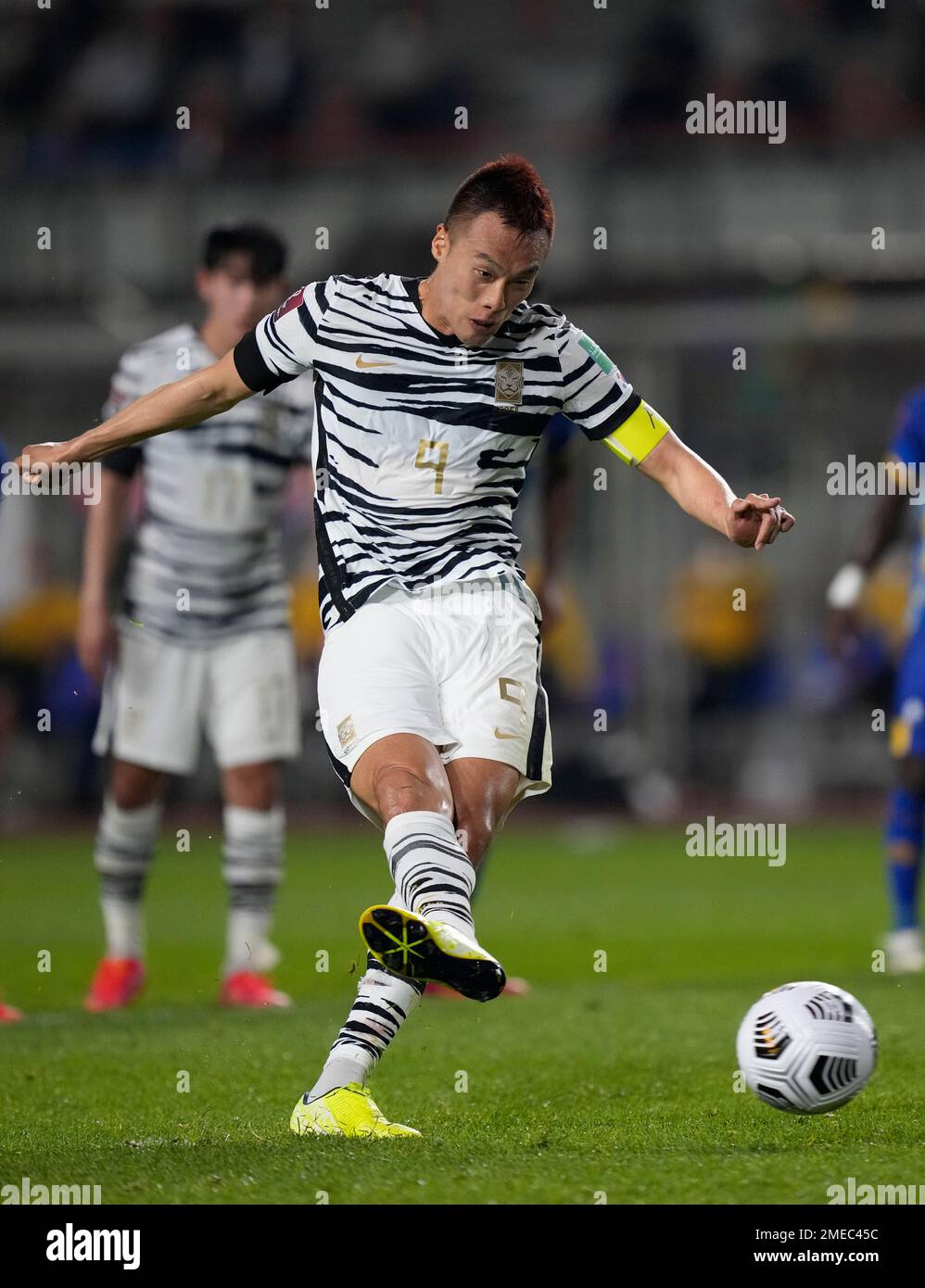 South Korea's Kim Shin-wook shoots a penalty shot against Sri Lanka ...