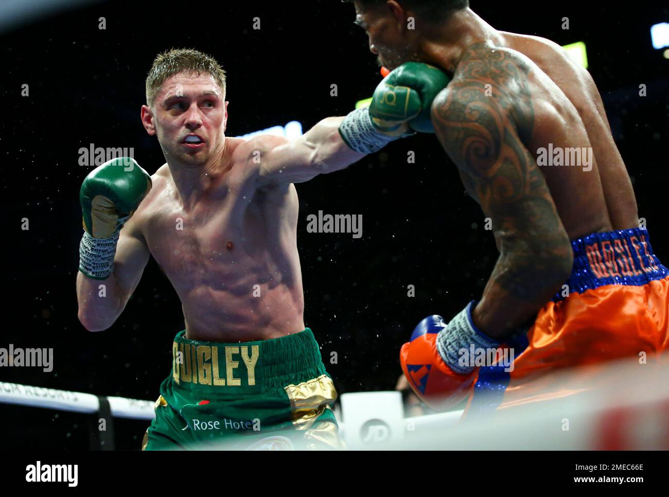 Jason Quigley, left, connects with Shane Mosley Jr. during their ...