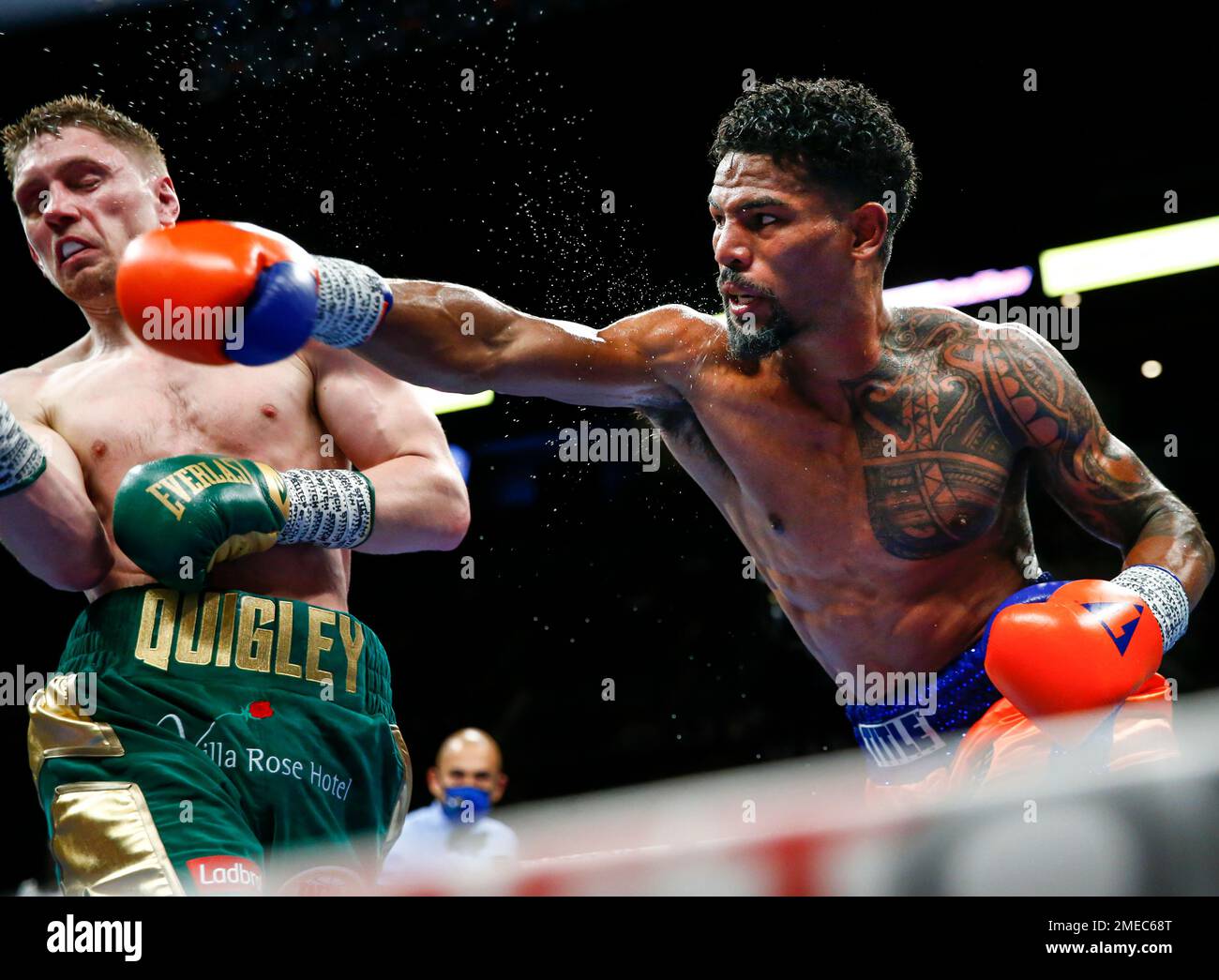 Jason Quigley, left, takes a hit from Shane Mosley Jr. during their ...