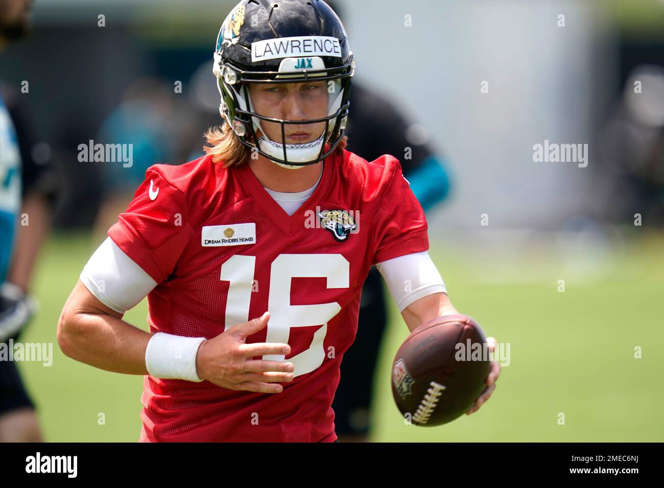 Jacksonville Jaguars quarterback Trevor Lawrence runs a play during an ...