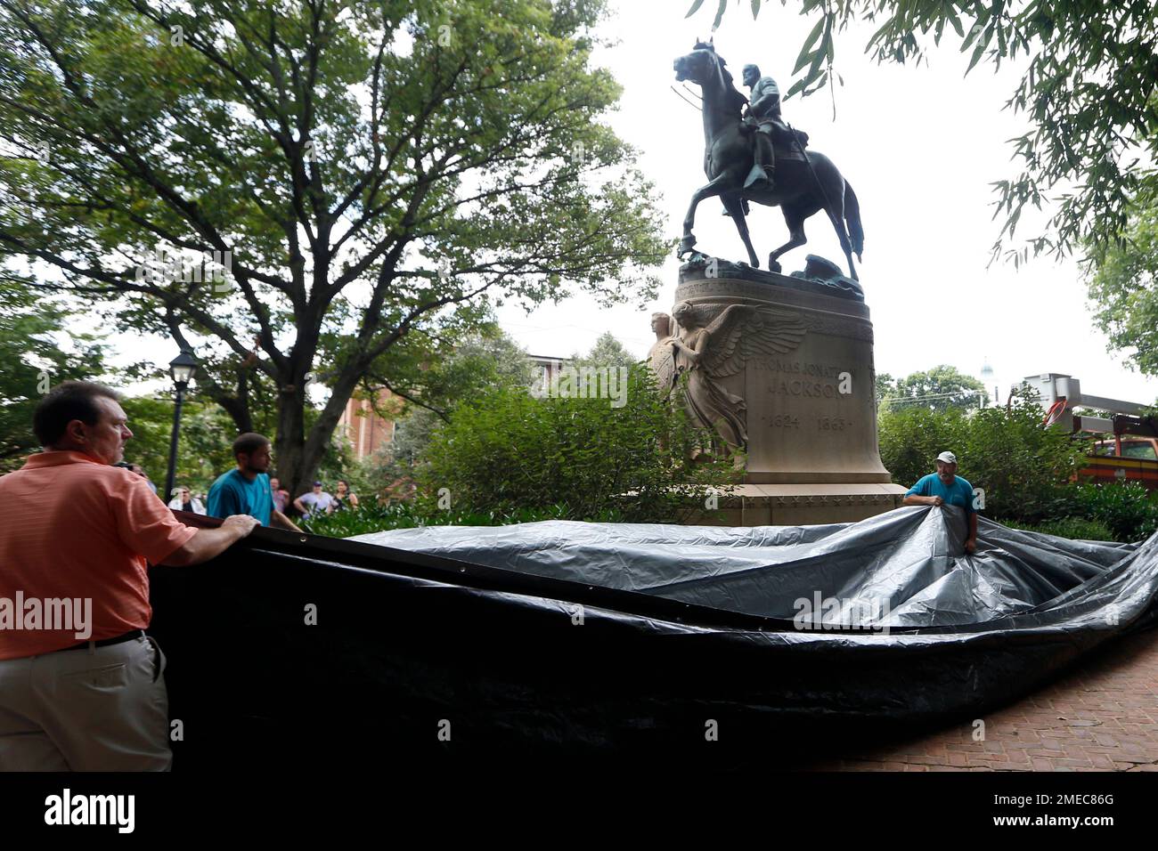 FILE - In this Aug. 23, 2017, file photo, city workers prepare to drape ...