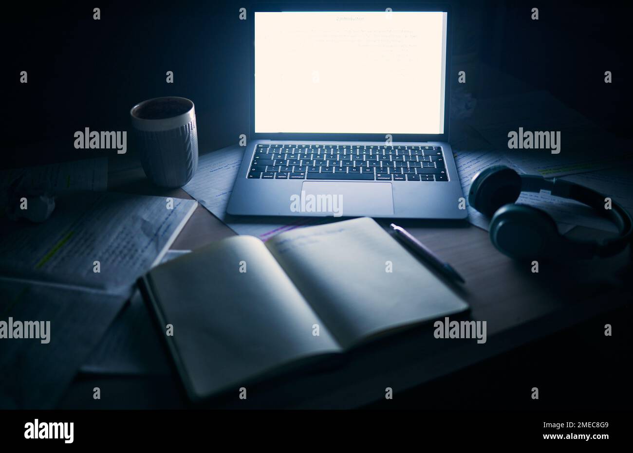 Laptop, mock up and study on table in dark student dormitory, room and ...
