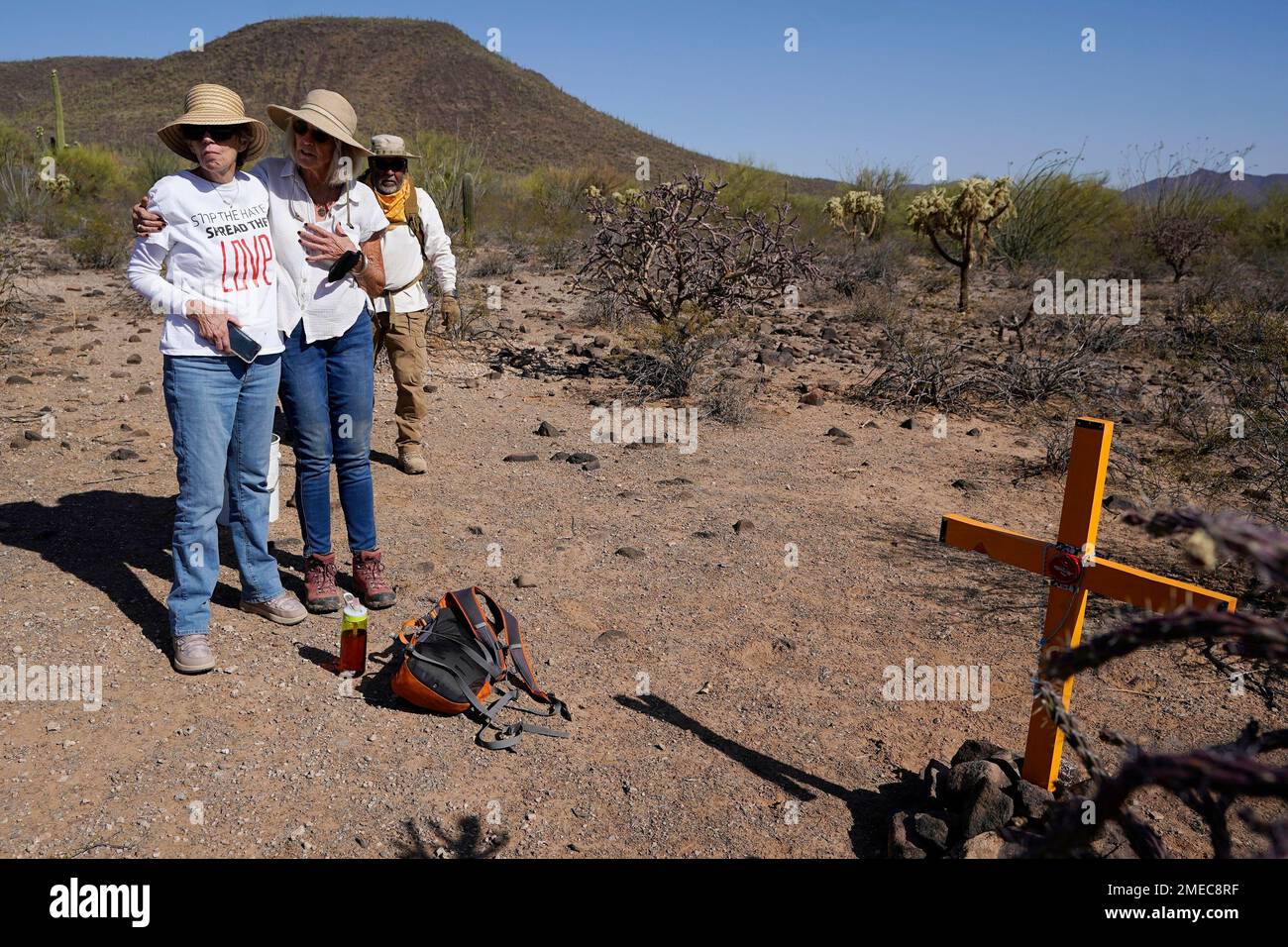 Tucson Samaritans volunteer Michele Maggiora, center, embraces Eileen O ...
