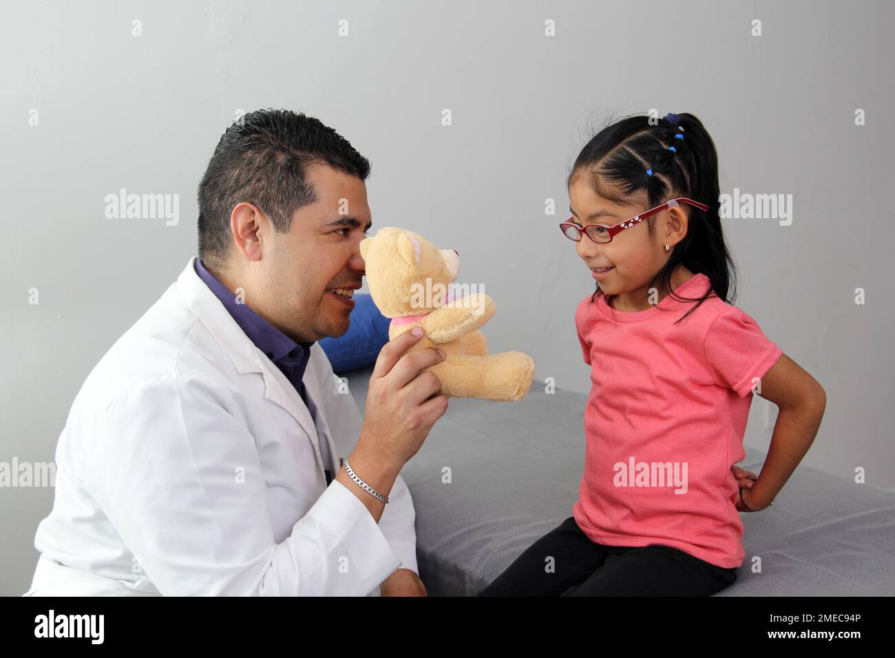 Latino Pediatric Specialist Doctor Plays With His Patient A 4 Year Old