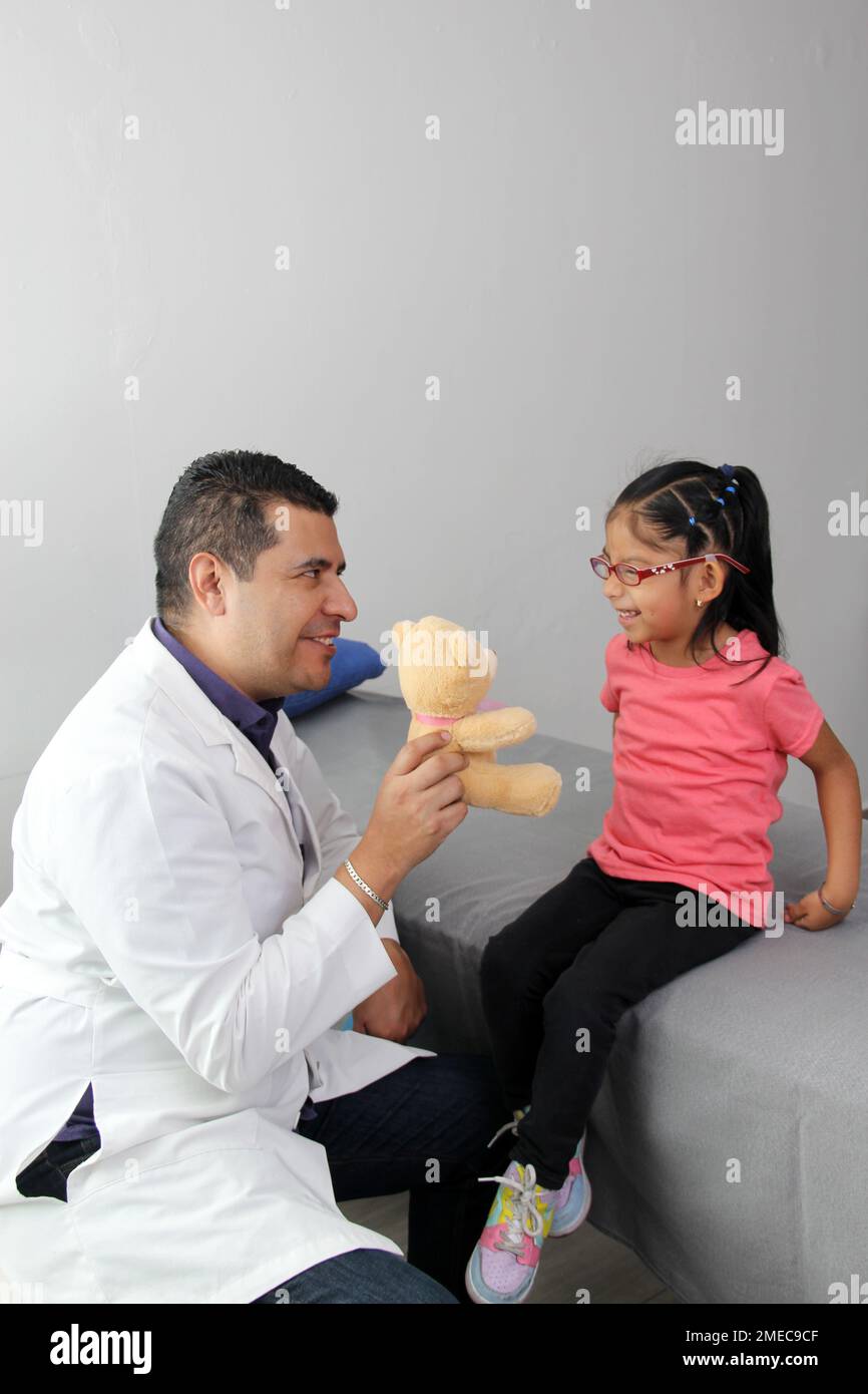 Latino Pediatric Specialist Doctor Plays With His Patient A 4 Year Old