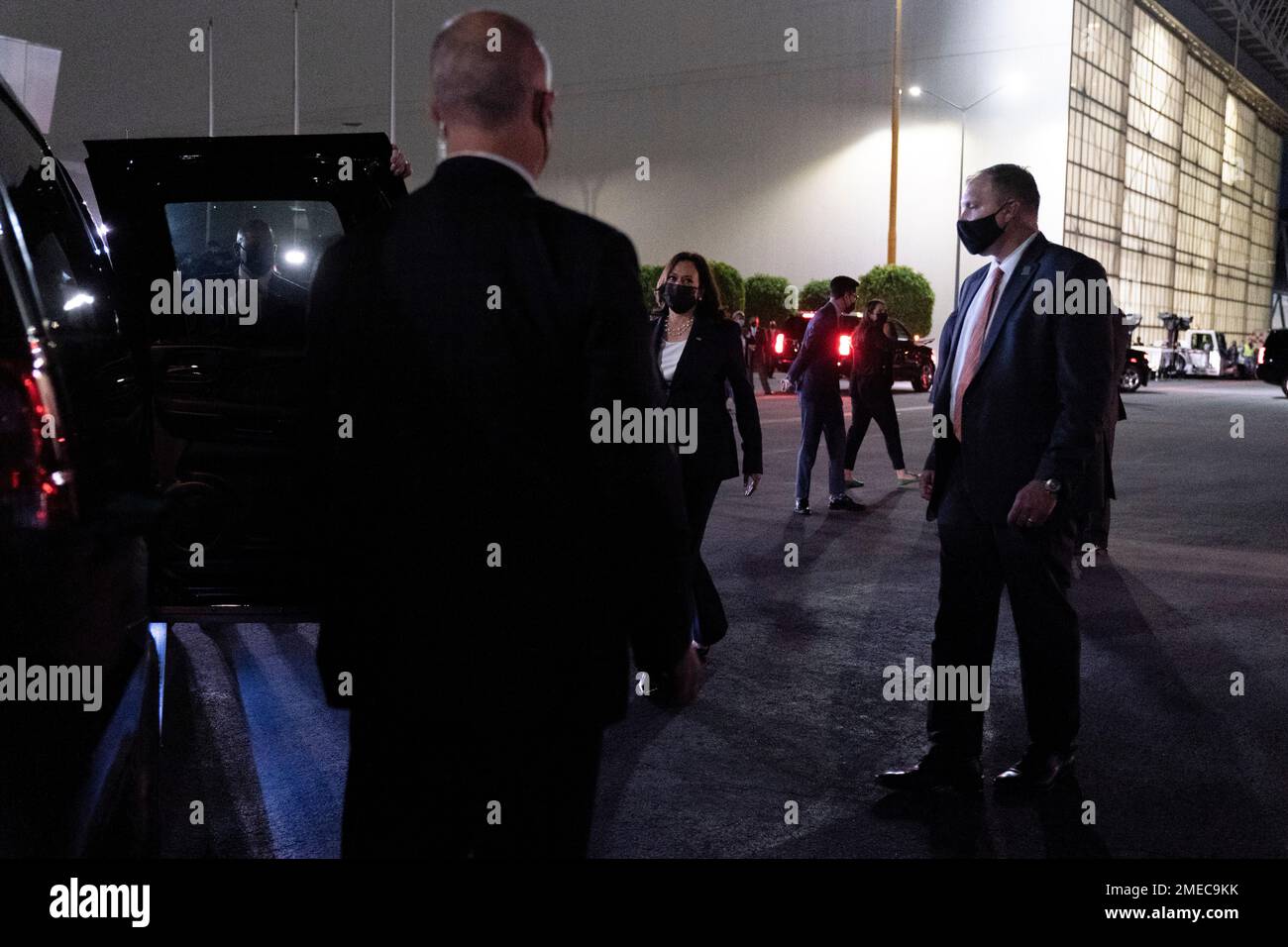 Vice President Kamala Harris, center, walks to her motorcade, Monday ...