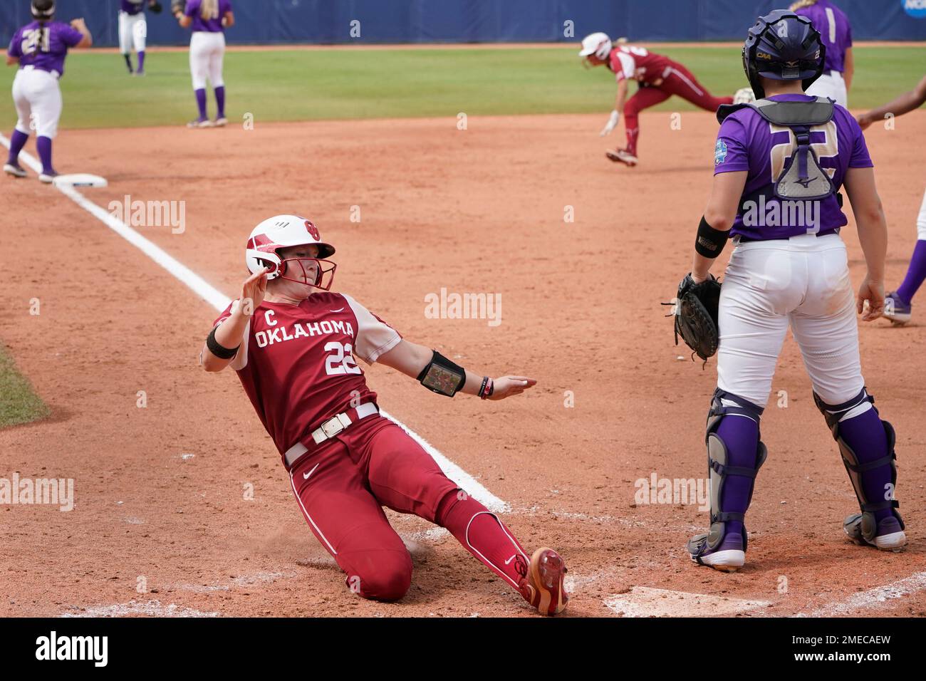 Oklahoma's Lynnsie Elam (22) scores behind James Madison catcher Lauren ...
