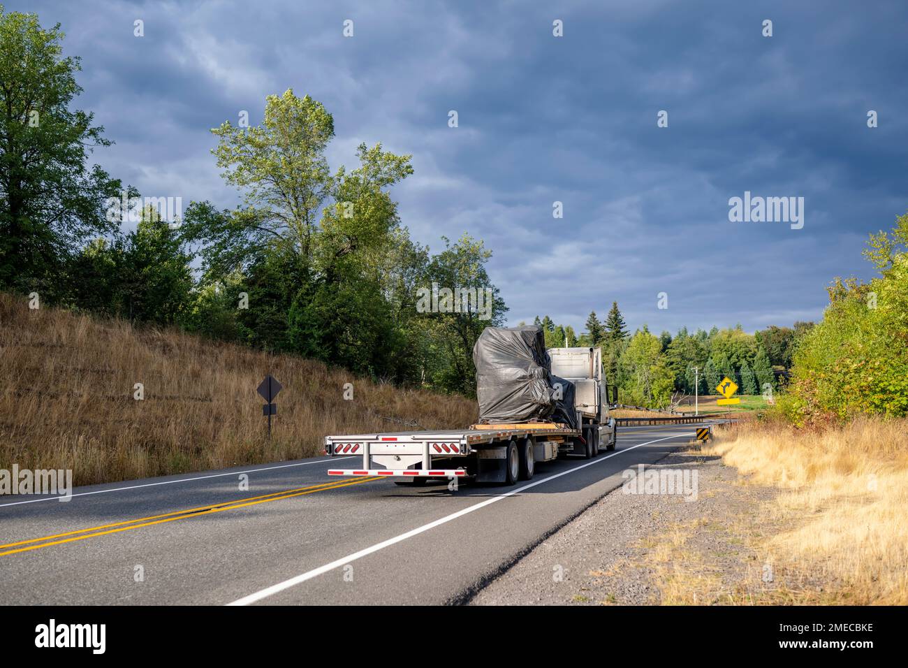 Industrial grade high cab American powerful classic white big rig semi ...