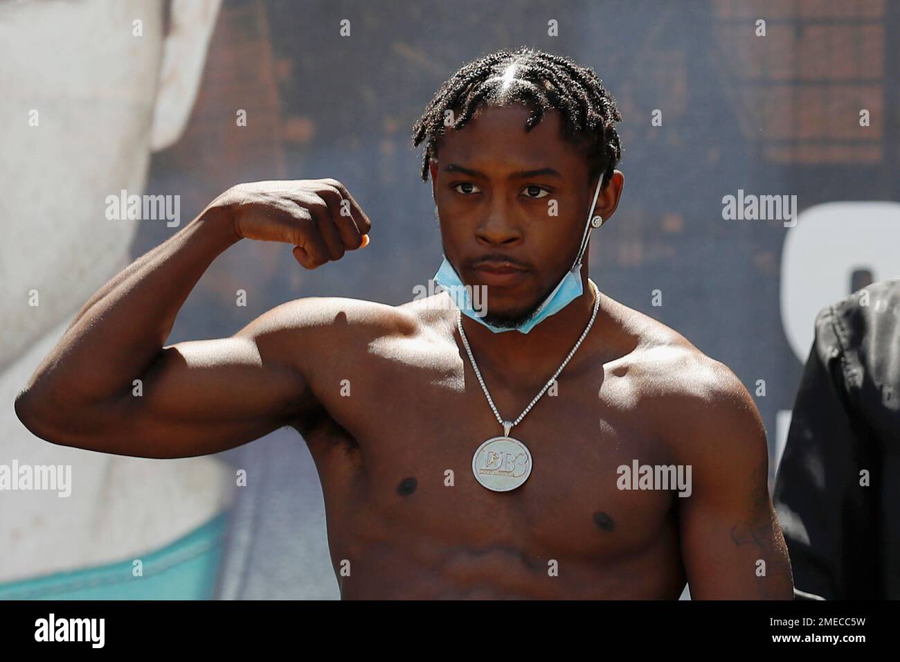 FILE - Boxer Keyshawn Davis poses after a weigh-in ahead of a fight ...