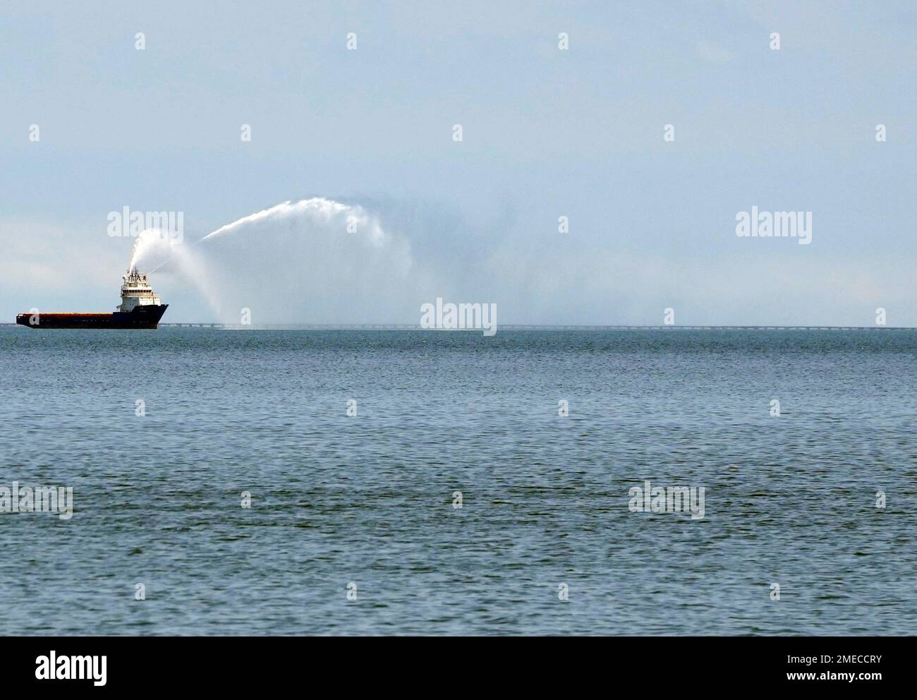 A ship sprays its water canons at the Caspian Sea outside the port in ...