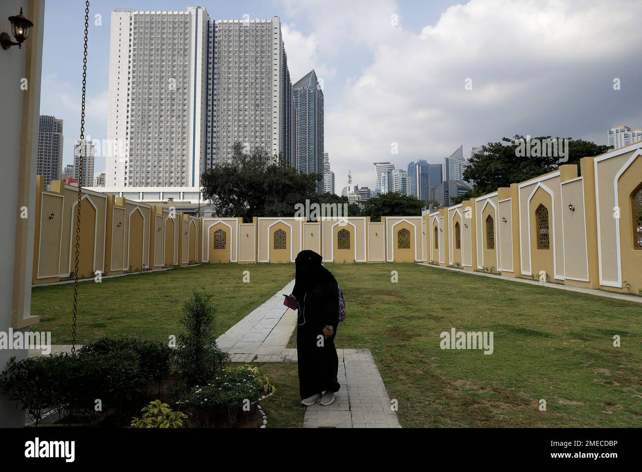 A woman walks through the newly inaugurated Manila Islamic Cemetery and Cultural Hall in Manila ...