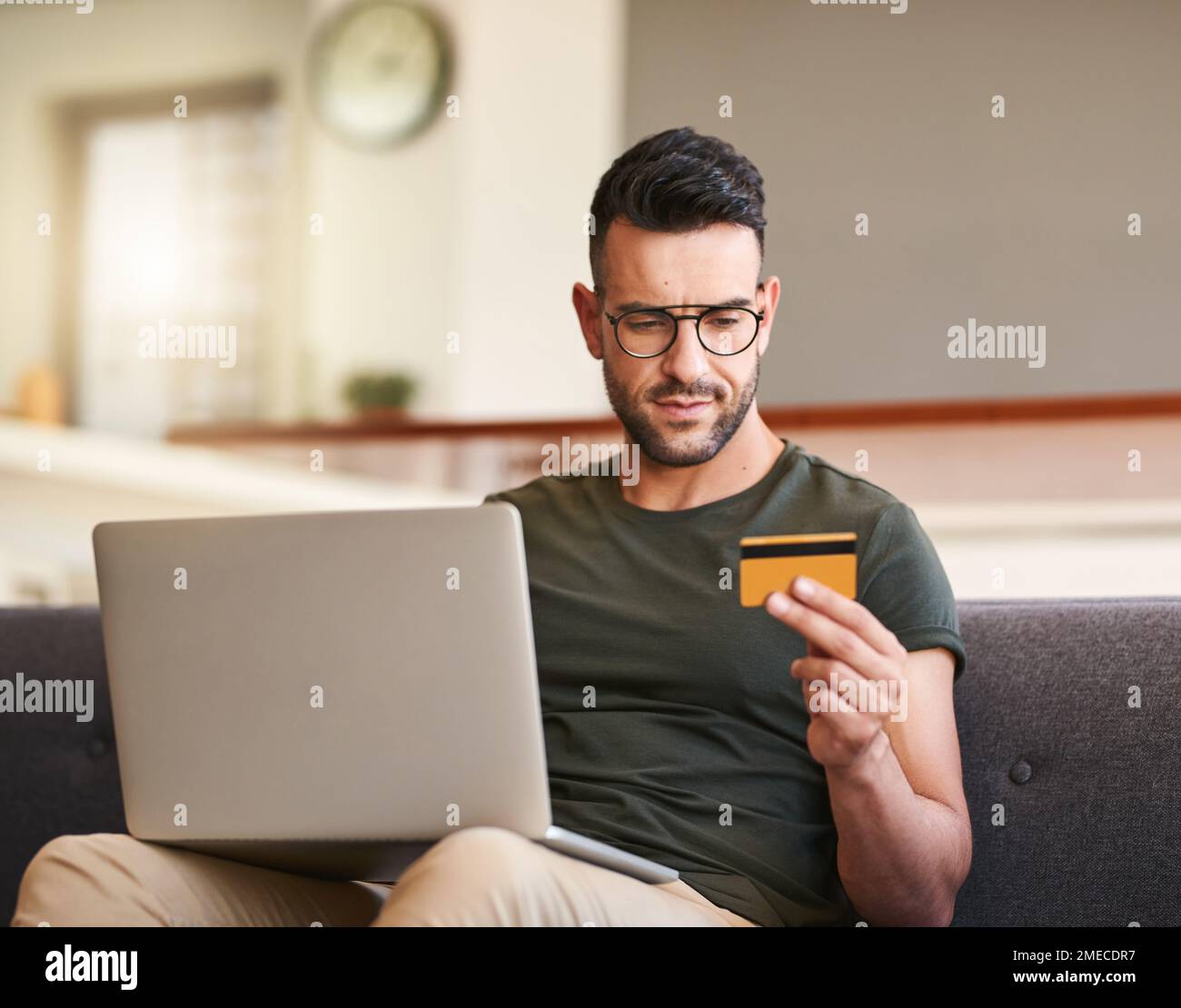 Young man credit card computer hi-res stock photography and images - Alamy