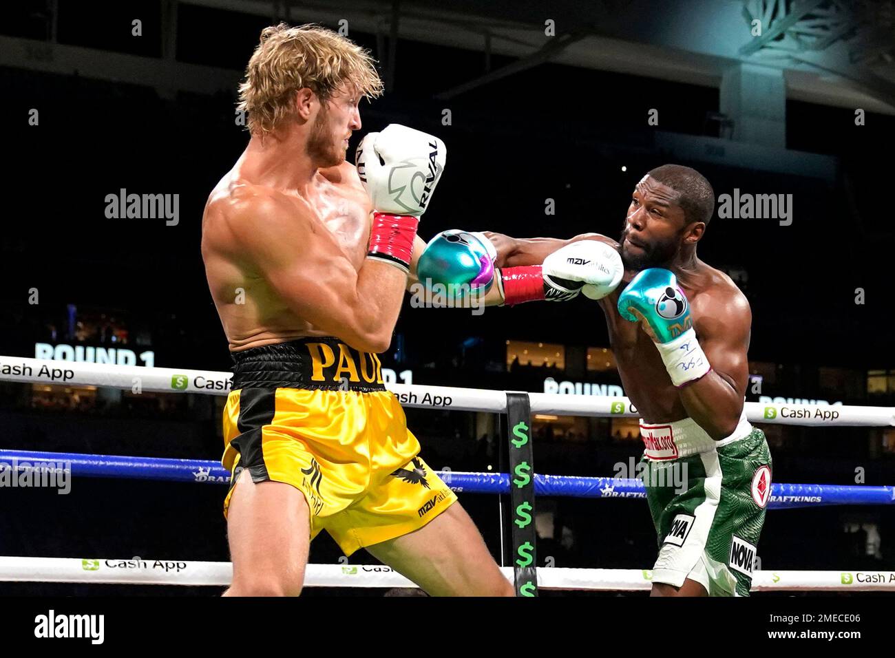 Logan Paul, left, and Floyd Mayweather fight during an exhibition ...