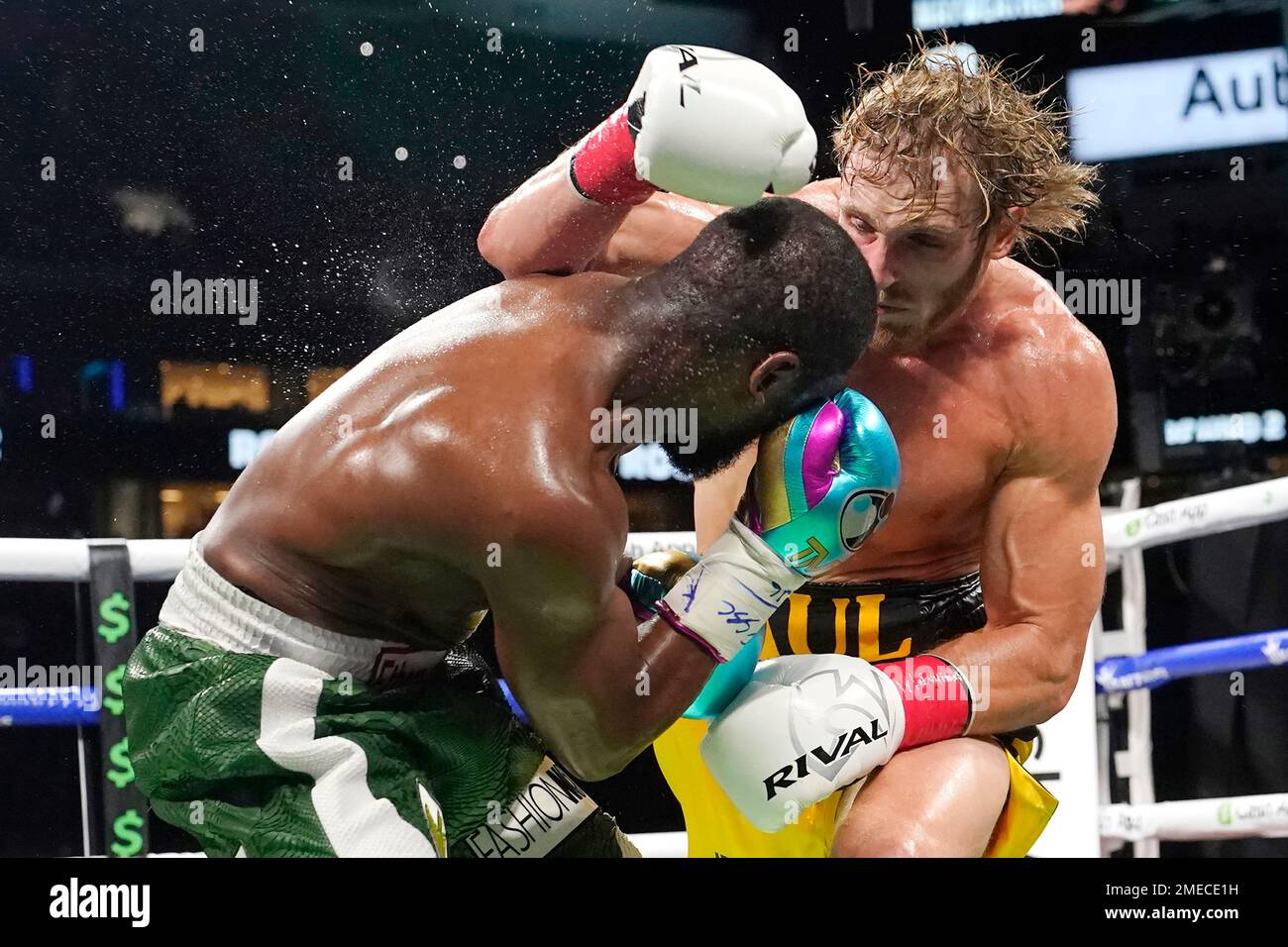 Floyd Mayweather, left, and Logan Paul fight during an exhibition ...