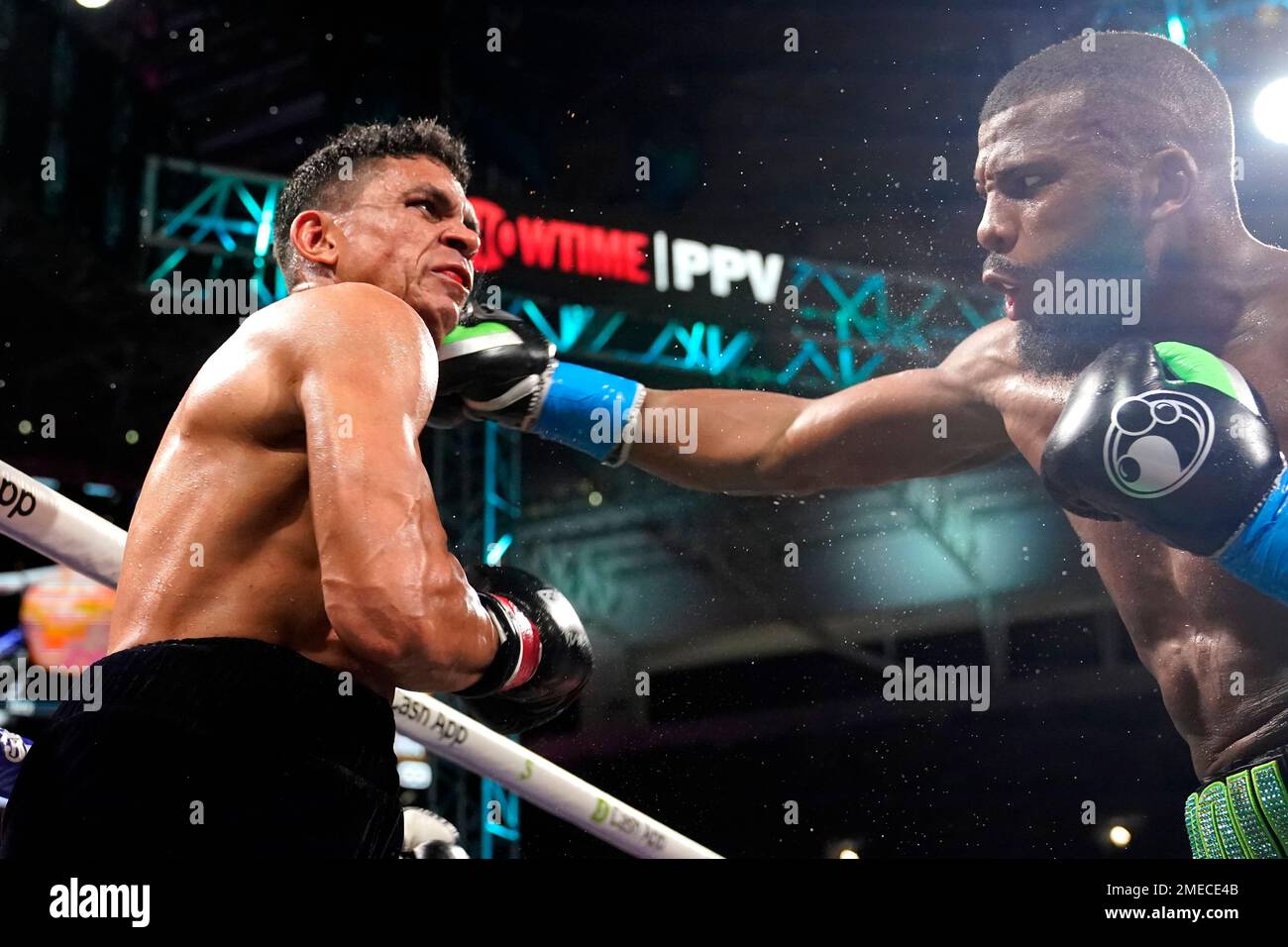 Dervin Colina, left, and Badou Jack, of Sweden, fight during a light ...
