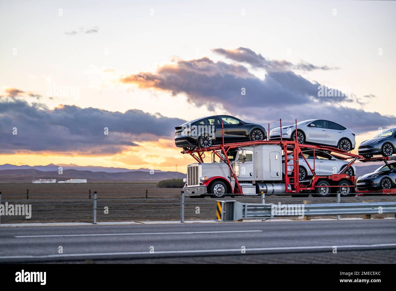 Industrial car hauler big rig white semi truck tractor transporting ...