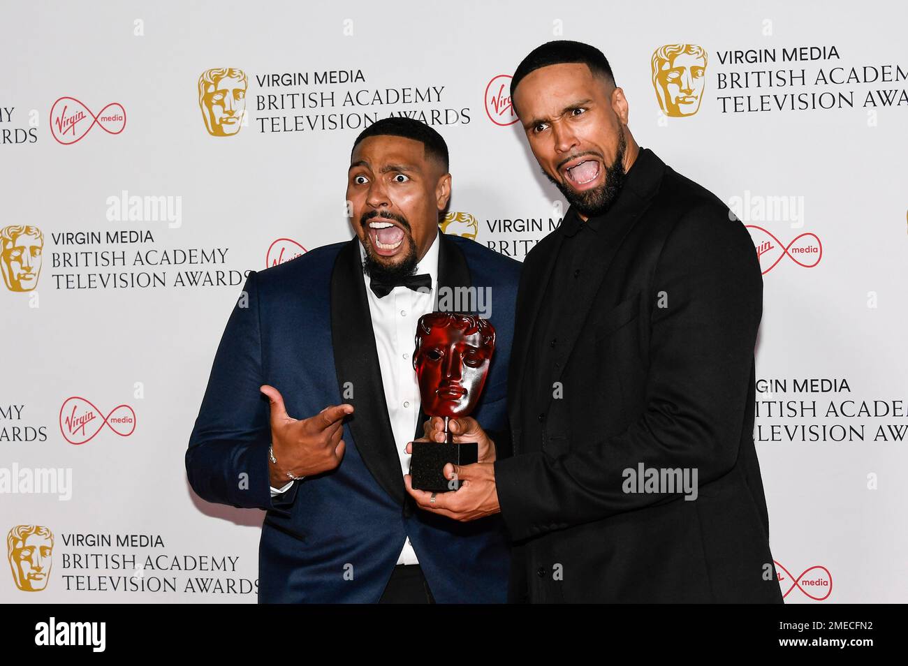 Jordan Banjo, left, and Ashley Banjo pose for photographers with their ...