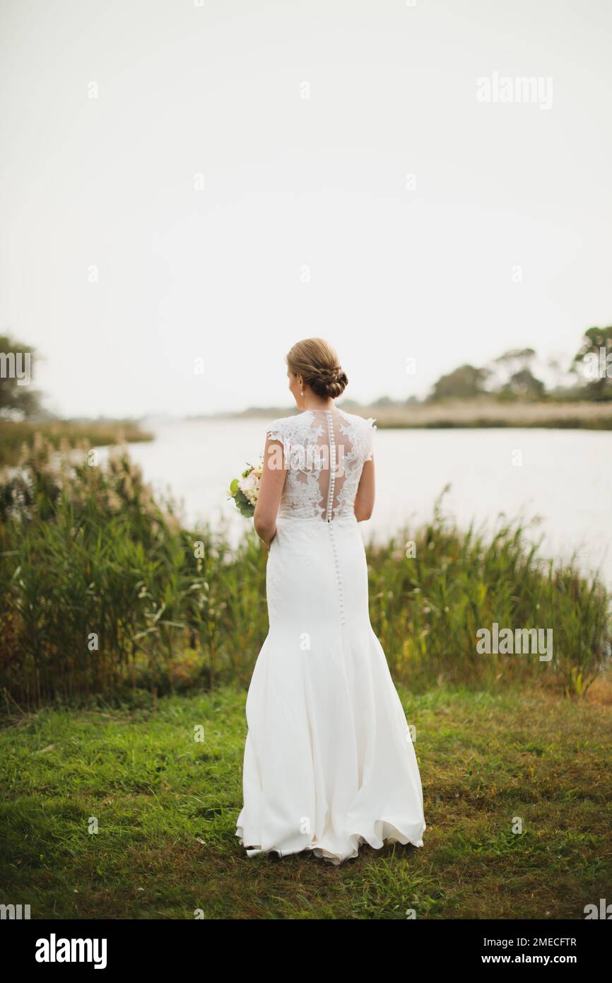 Bride and Groom Backs hugging and kissing couple no faces Stock Photo ...