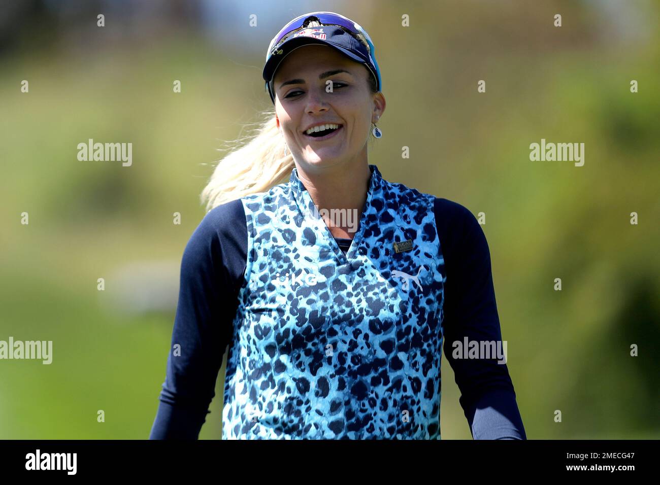 Lexi Thompson smiles as she walks down the first fairway during the ...
