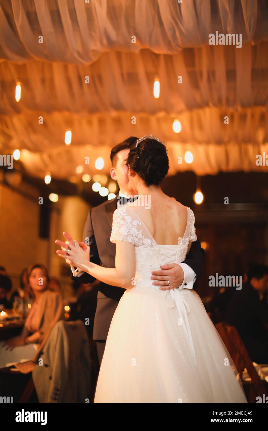 Bride and Groom Backs hugging and kissing couple no faces Stock Photo ...