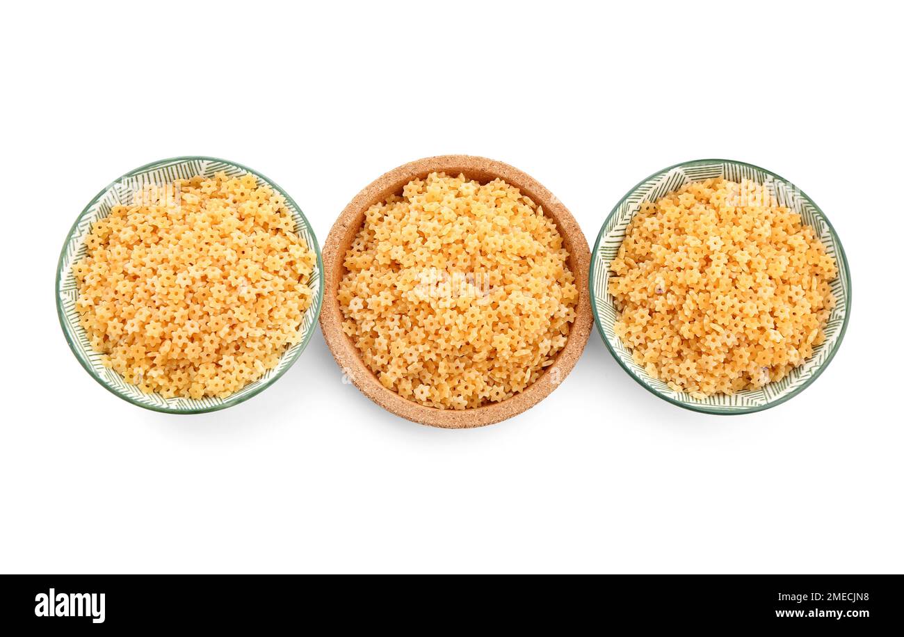 Bowls of raw stelline pasta isolated on white background Stock Photo ...