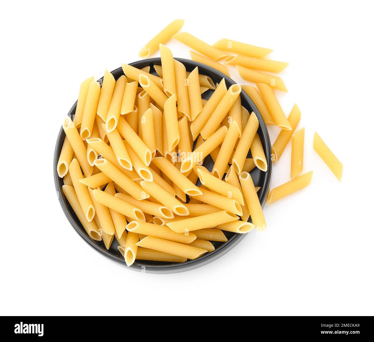 Plate of raw penne pasta on white background Stock Photo - Alamy