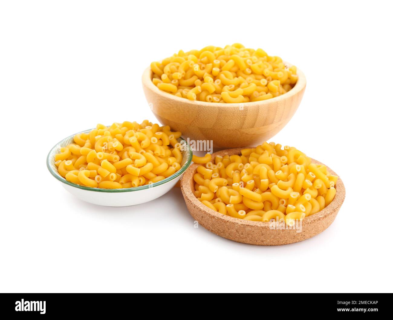 Bowls of uncooked elbow pasta isolated on white background Stock Photo ...