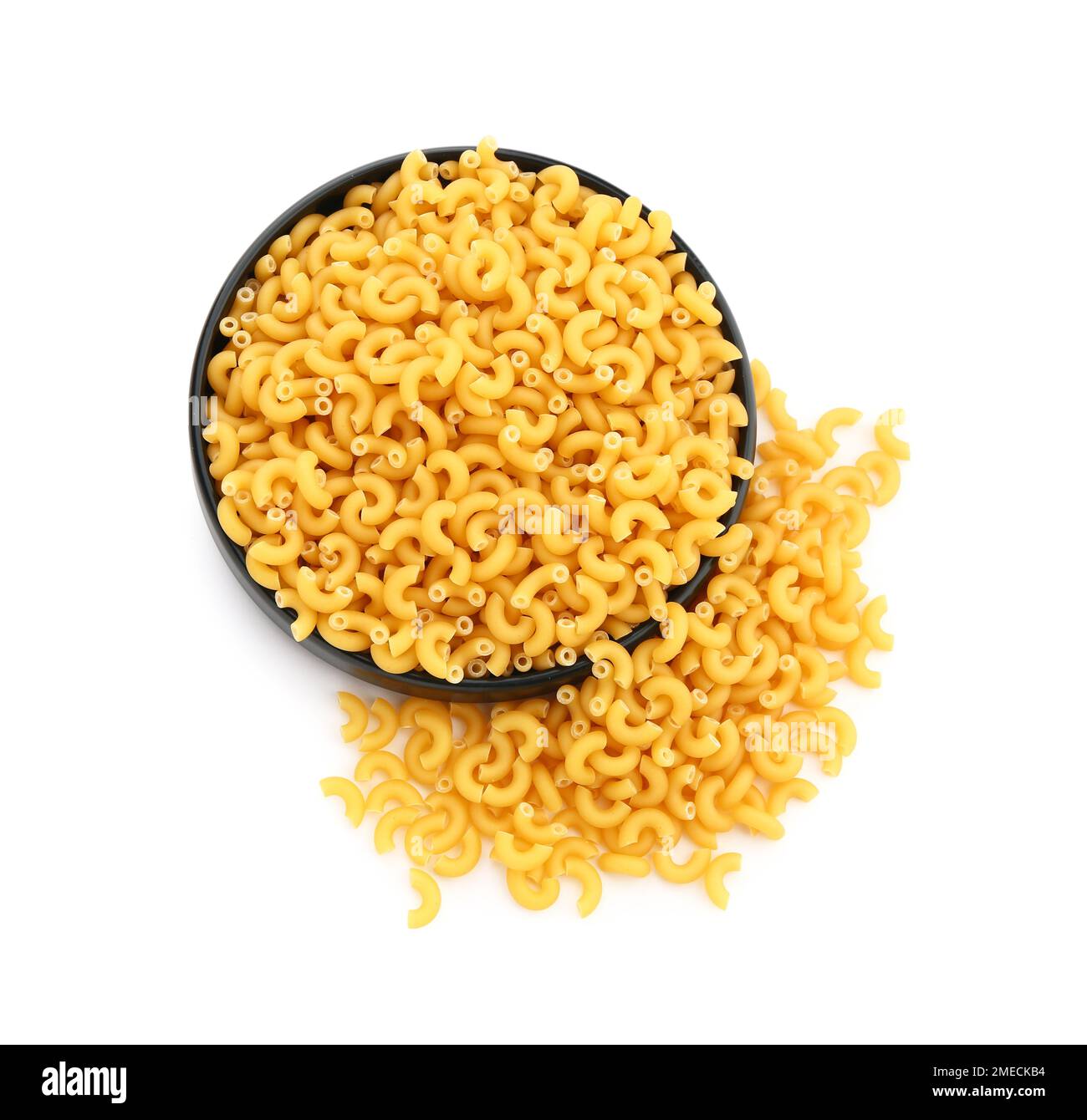 Plate of raw elbow pasta isolated on white background Stock Photo - Alamy