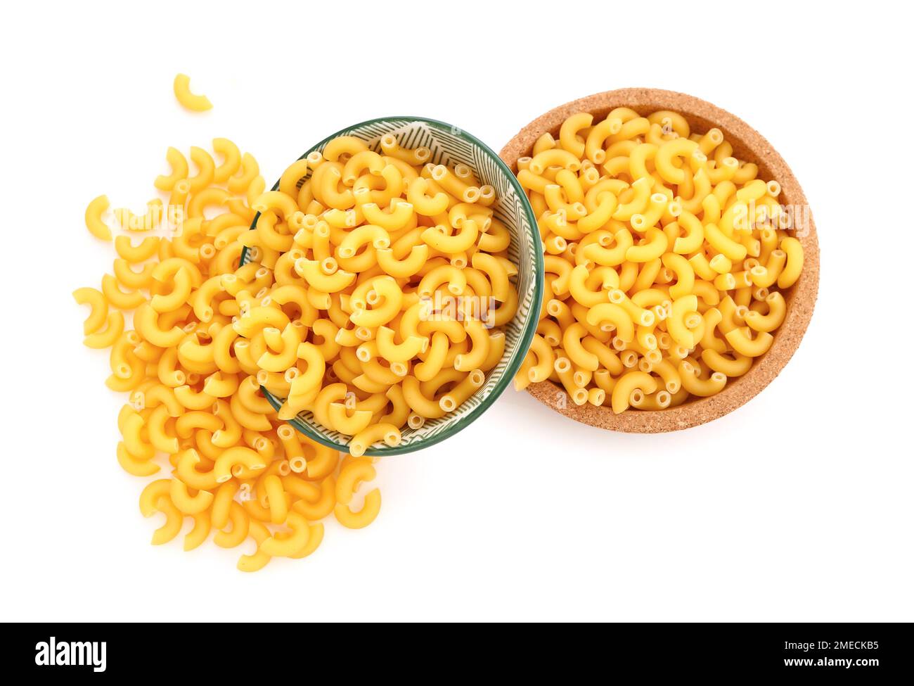 Plates of raw elbow pasta isolated on white background Stock Photo - Alamy