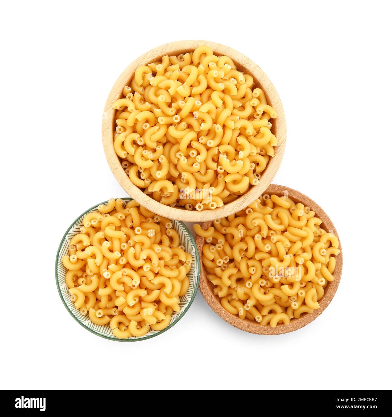 Bowls of uncooked elbow pasta isolated on white background Stock Photo ...