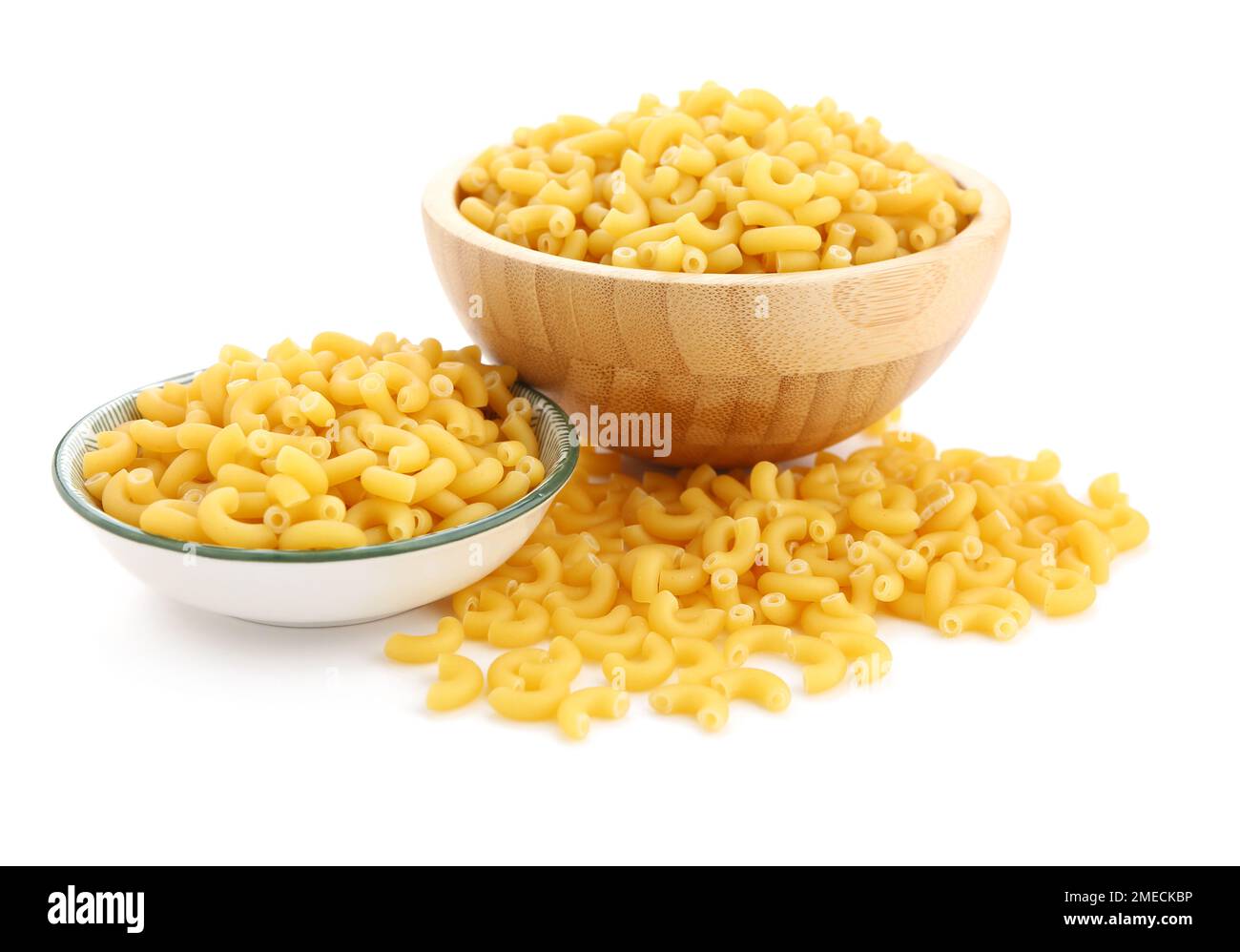 Bowls of uncooked elbow pasta isolated on white background Stock Photo ...