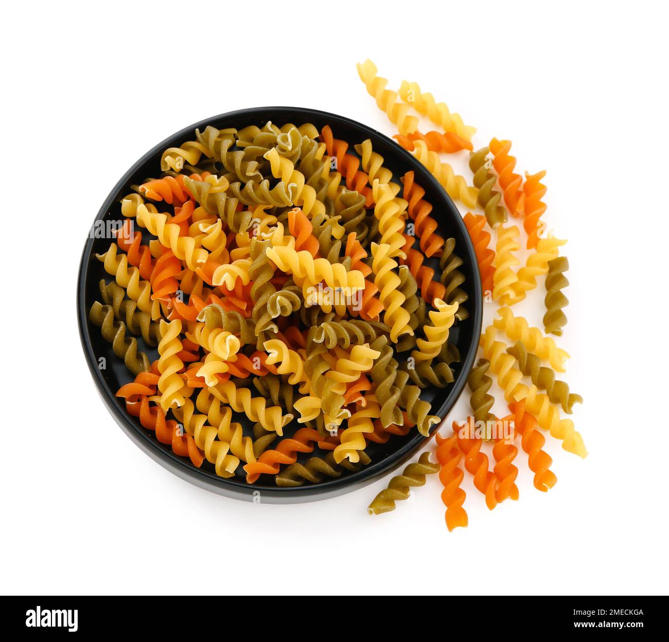 Plate of raw fusilli pasta on white background Stock Photo - Alamy