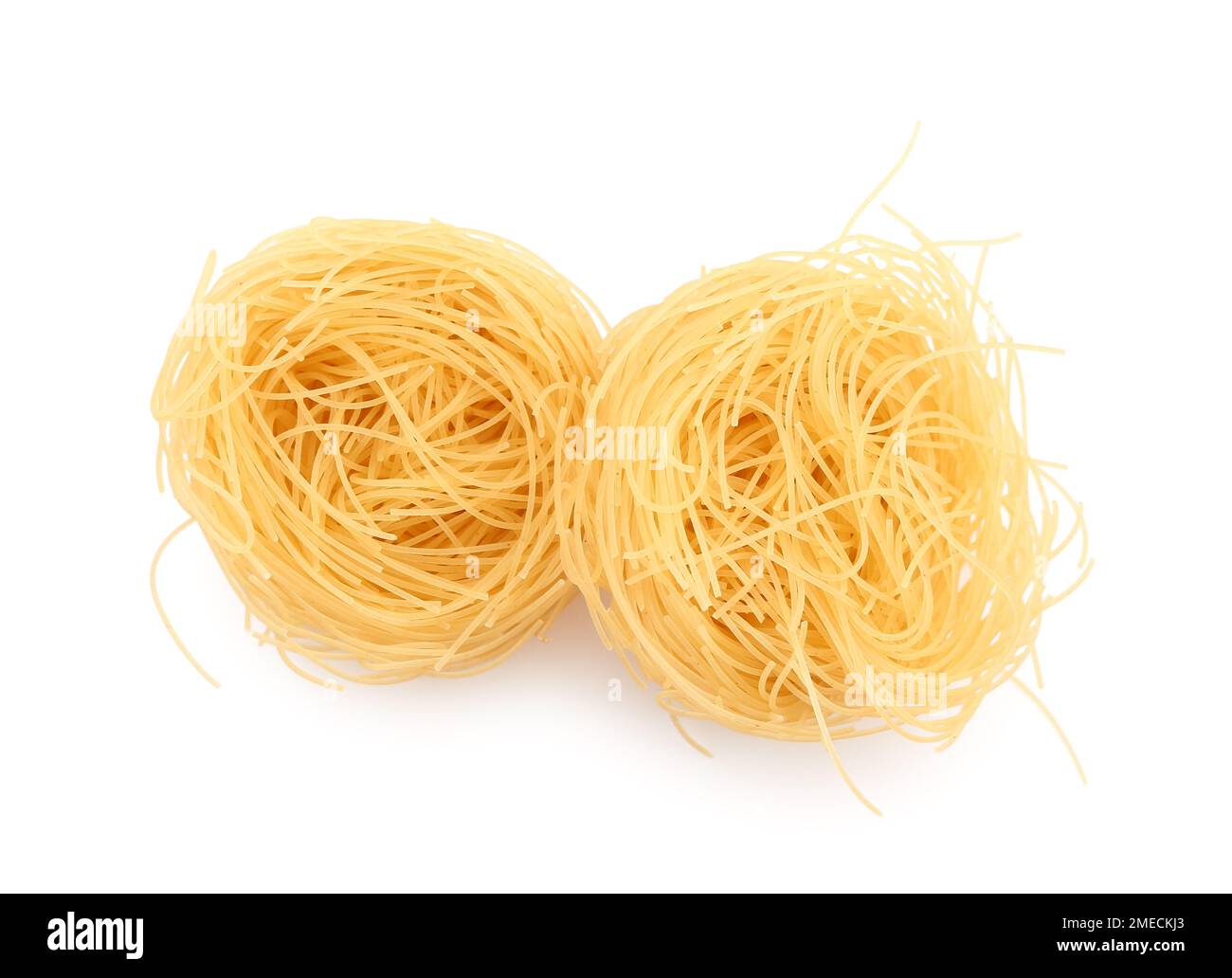 Raw pasta nests on white background Stock Photo - Alamy