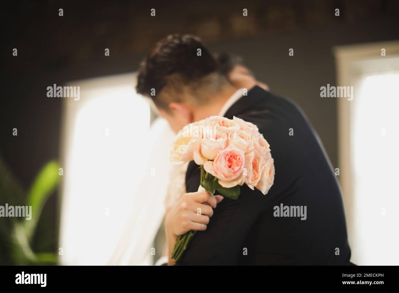 Bride and Groom Backs hugging and kissing couple no faces Stock Photo ...