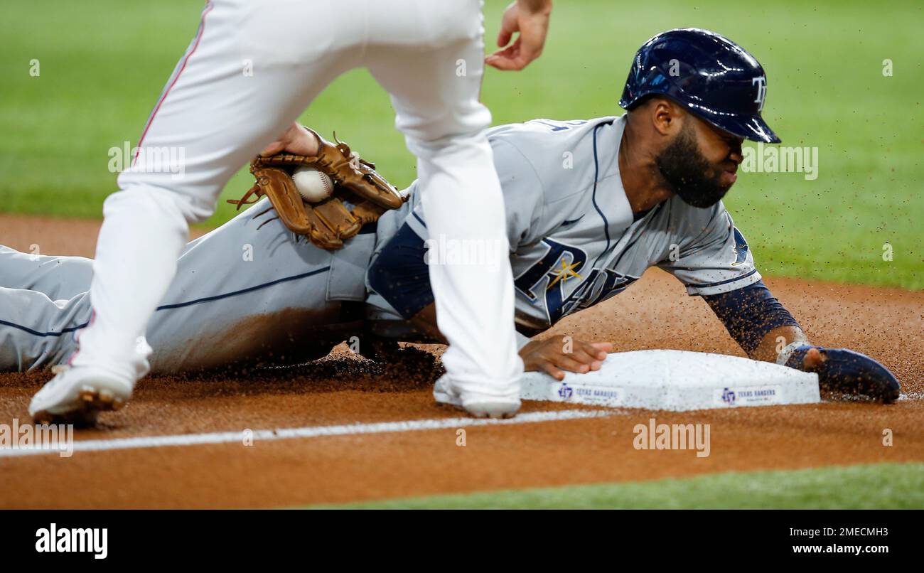 Tampa Bay Rays' Manuel Margot (13) is safe as Texas Rangers third baseman Charlie Culberson (2 ...