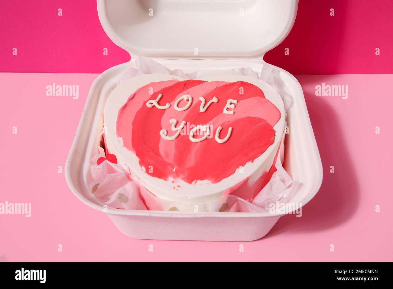 Lunch box with heart-shaped bento cake for Valentine's Day on pink ...