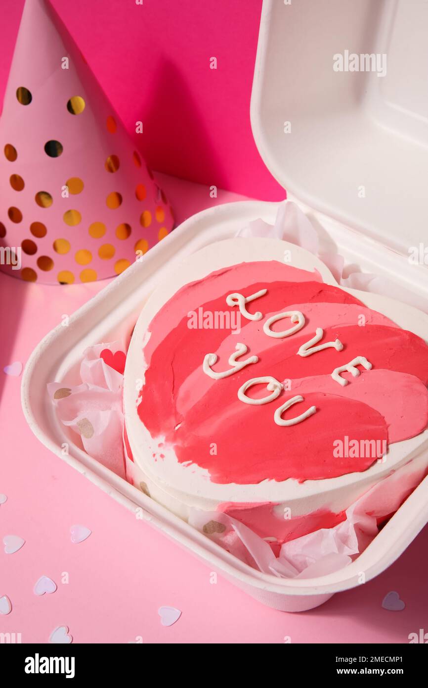 Lunch box with heart-shaped bento cake and party hat for Valentine's ...