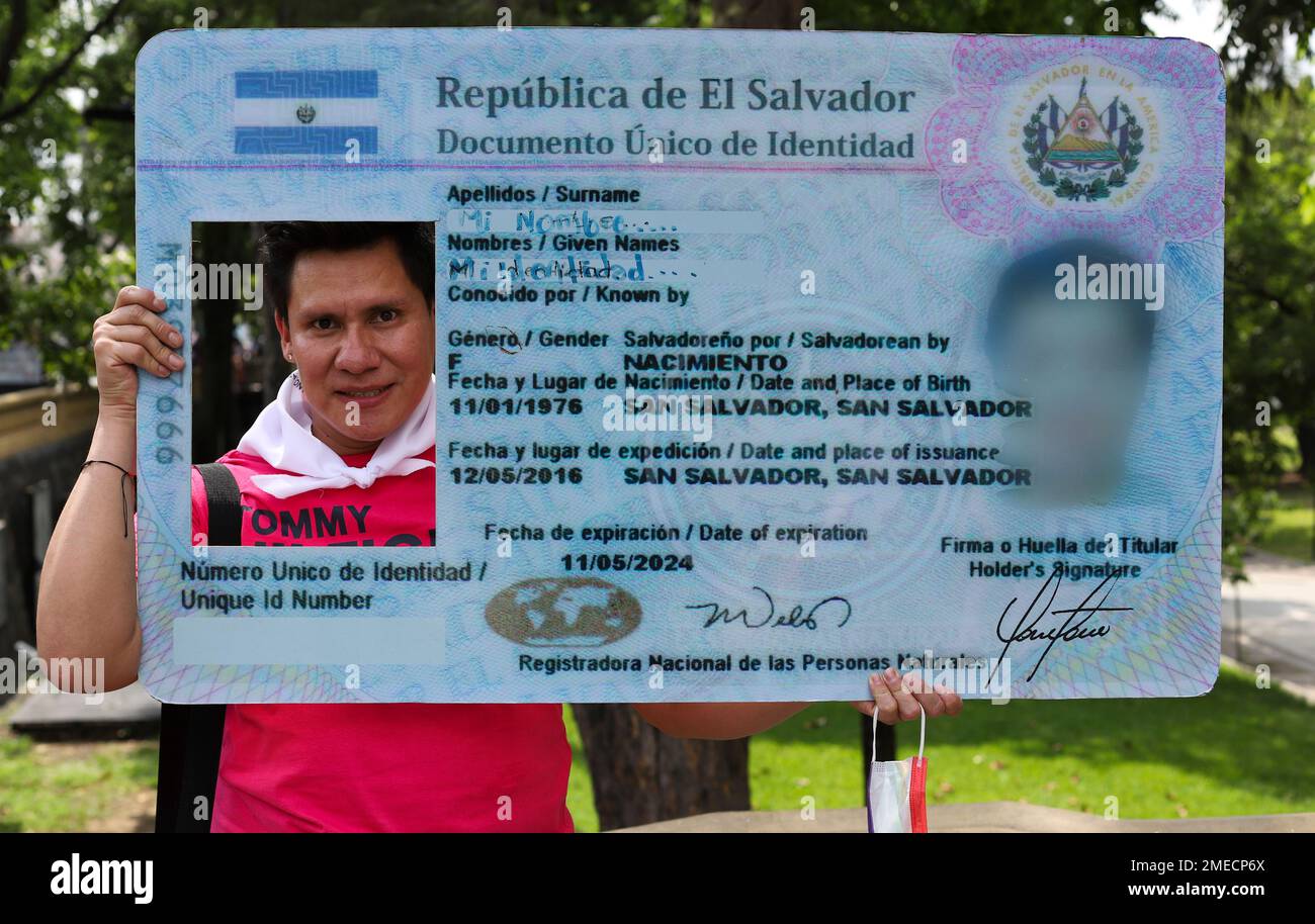 Wilson Escobar poses for a photo with a giant cutout of ID card, prior ...