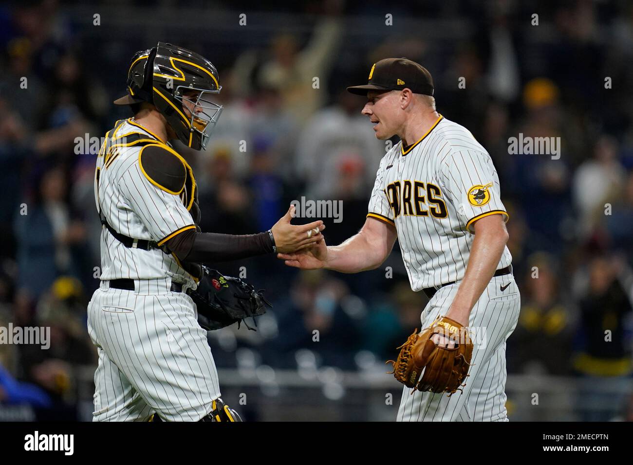San Diego Padres catcher Victor Caratini, left, reacts with relief ...