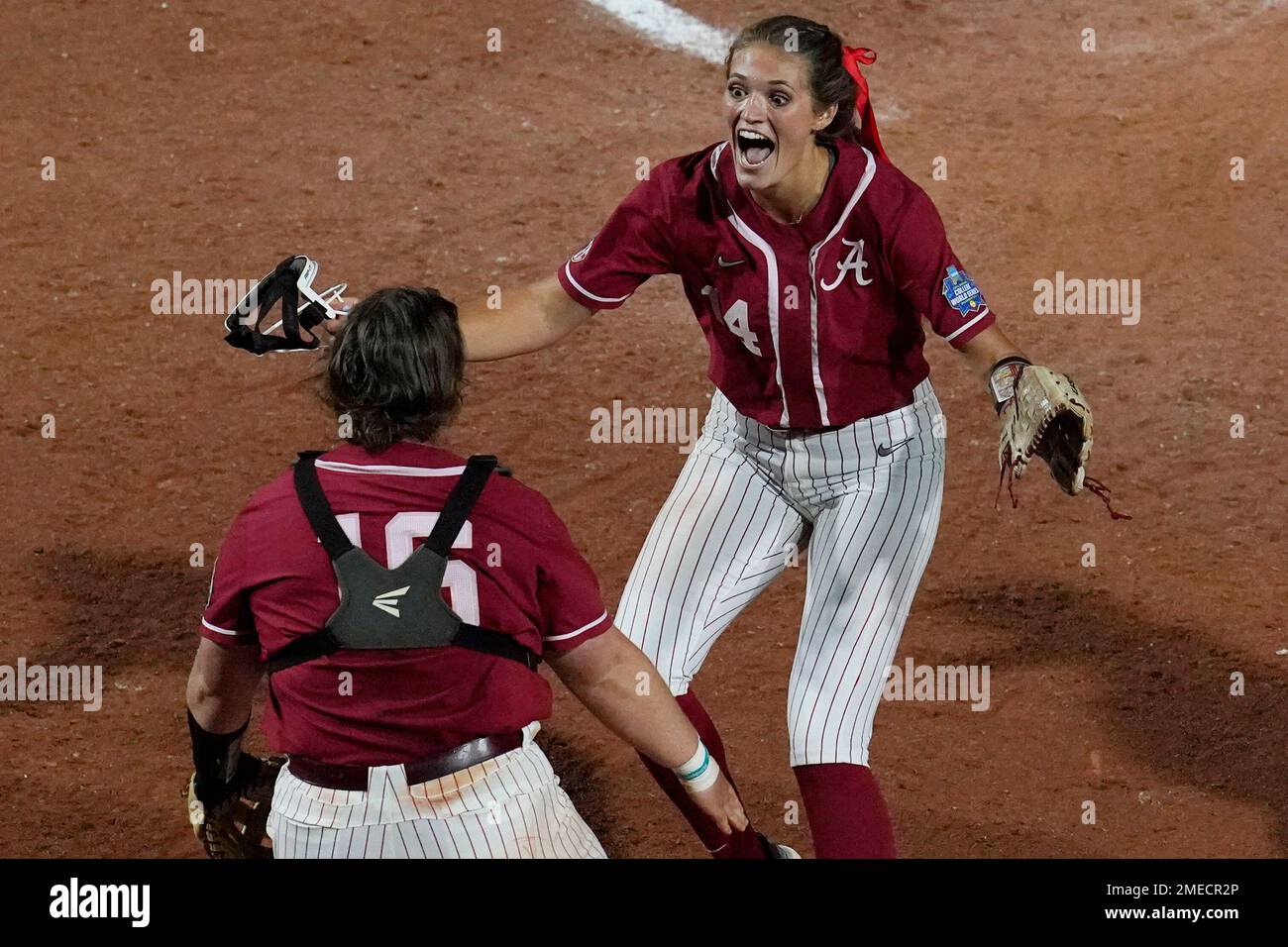 Alabama pitcher Montana Fouts, right, celebrates her perfect game with ...