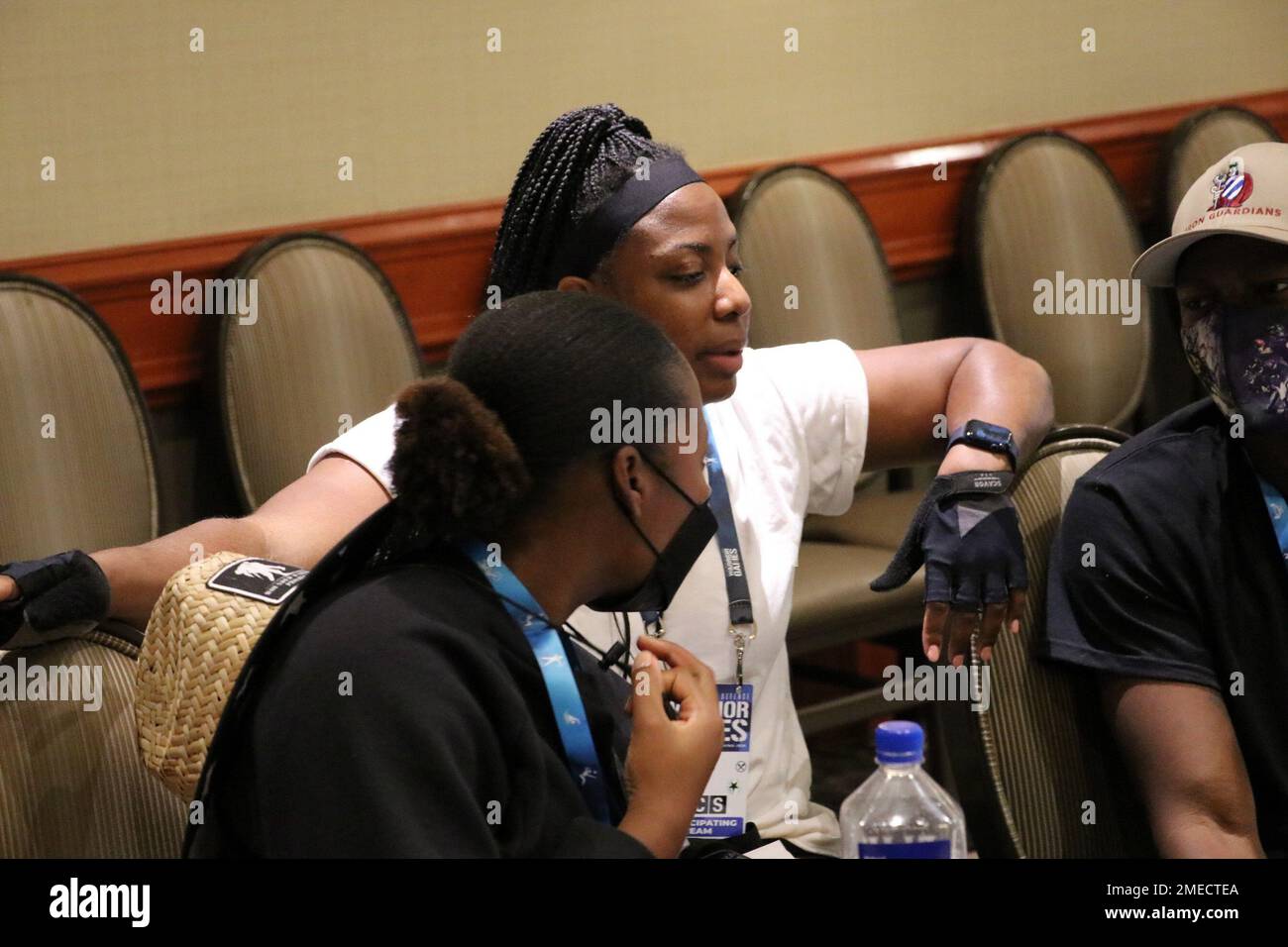 U.S. Army Cpl. Tiffanie Johnson, left, and Pfc. Corine Hamilton, center ...