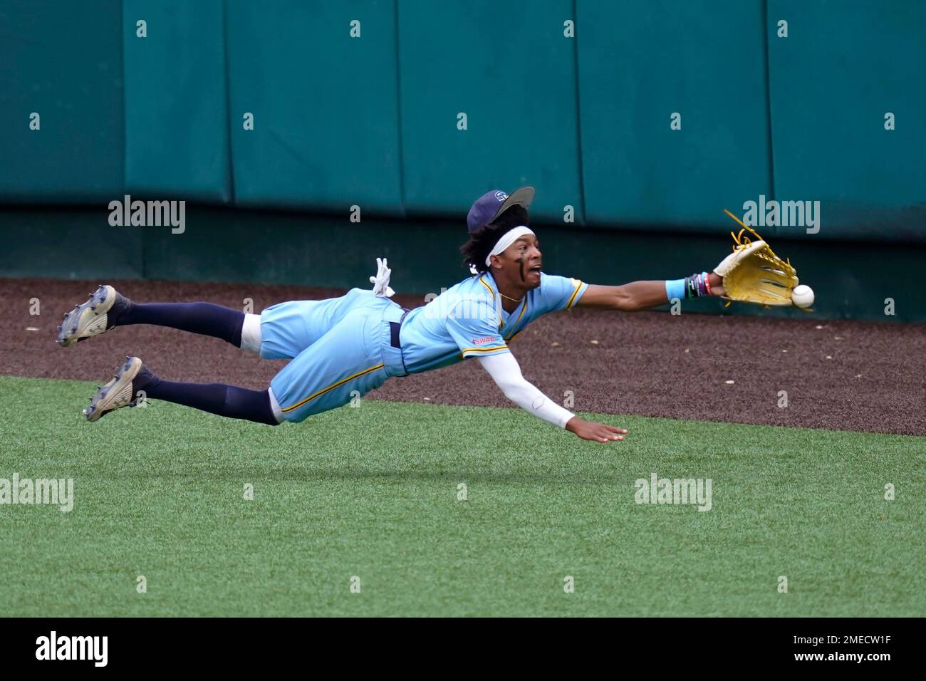 Southern centerfielder Isaiah Adams dives for a hit by Texas' Mitchell ...