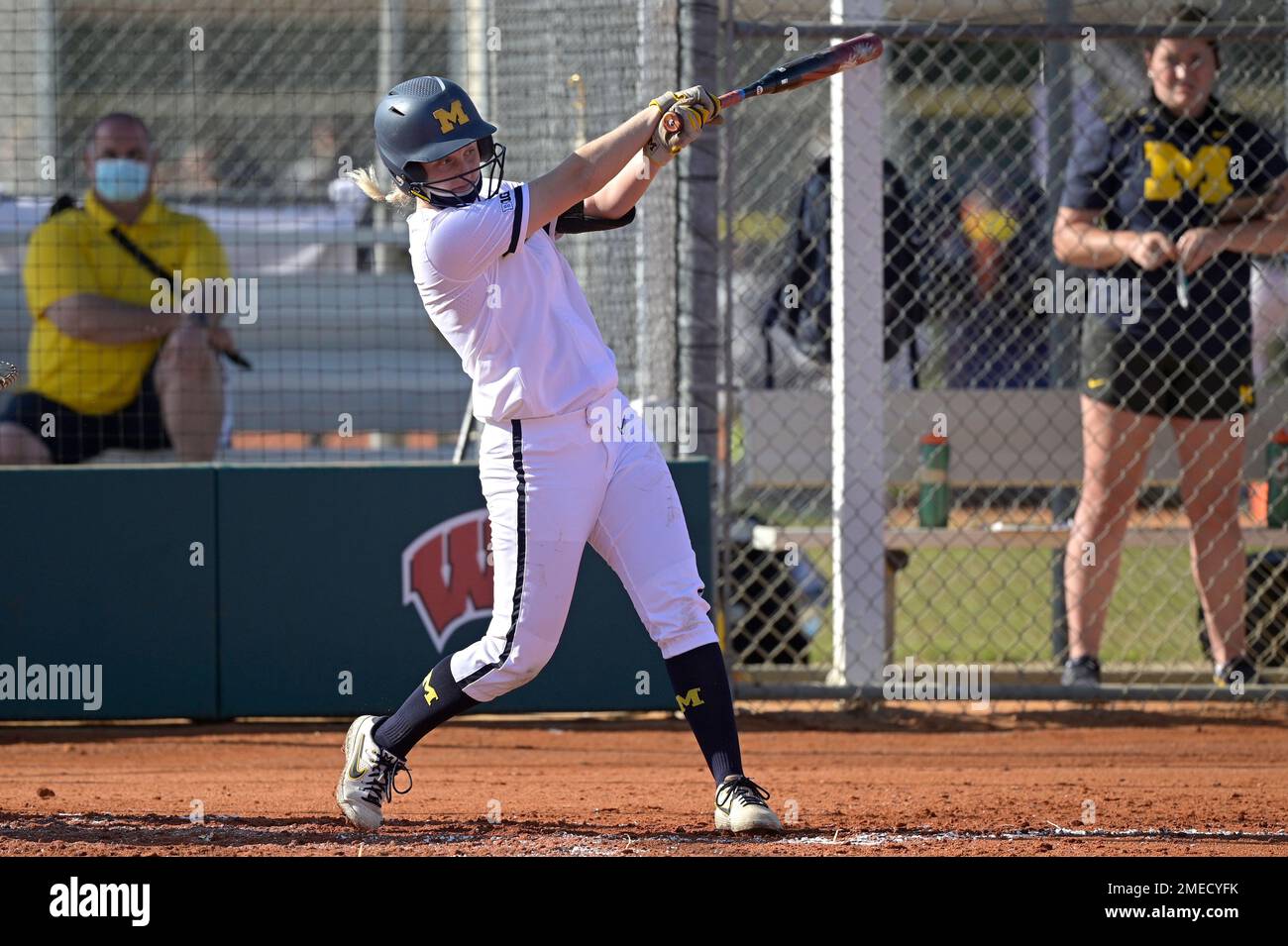 Michigan's Lexi Voss hits a pitch during an NCAA college softball game ...