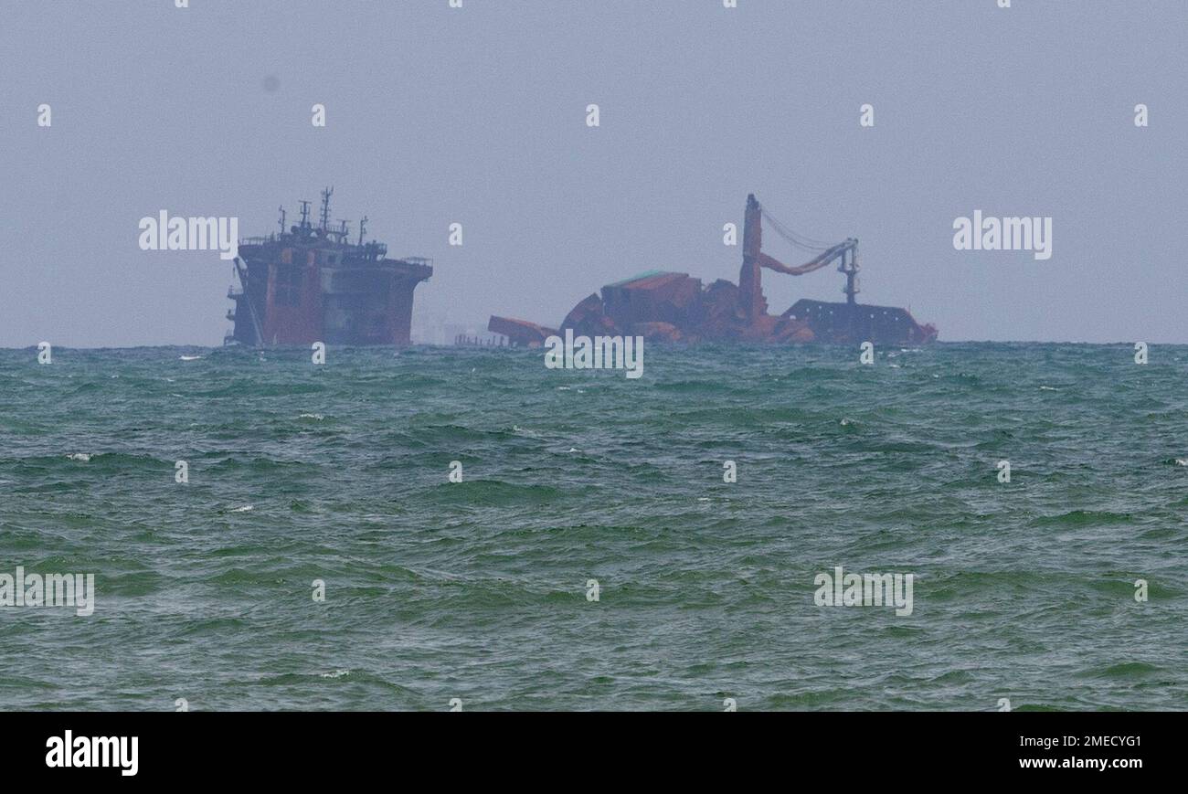 Fire-damaged container ship MV X-Press Pearl is seen partially sunk ...