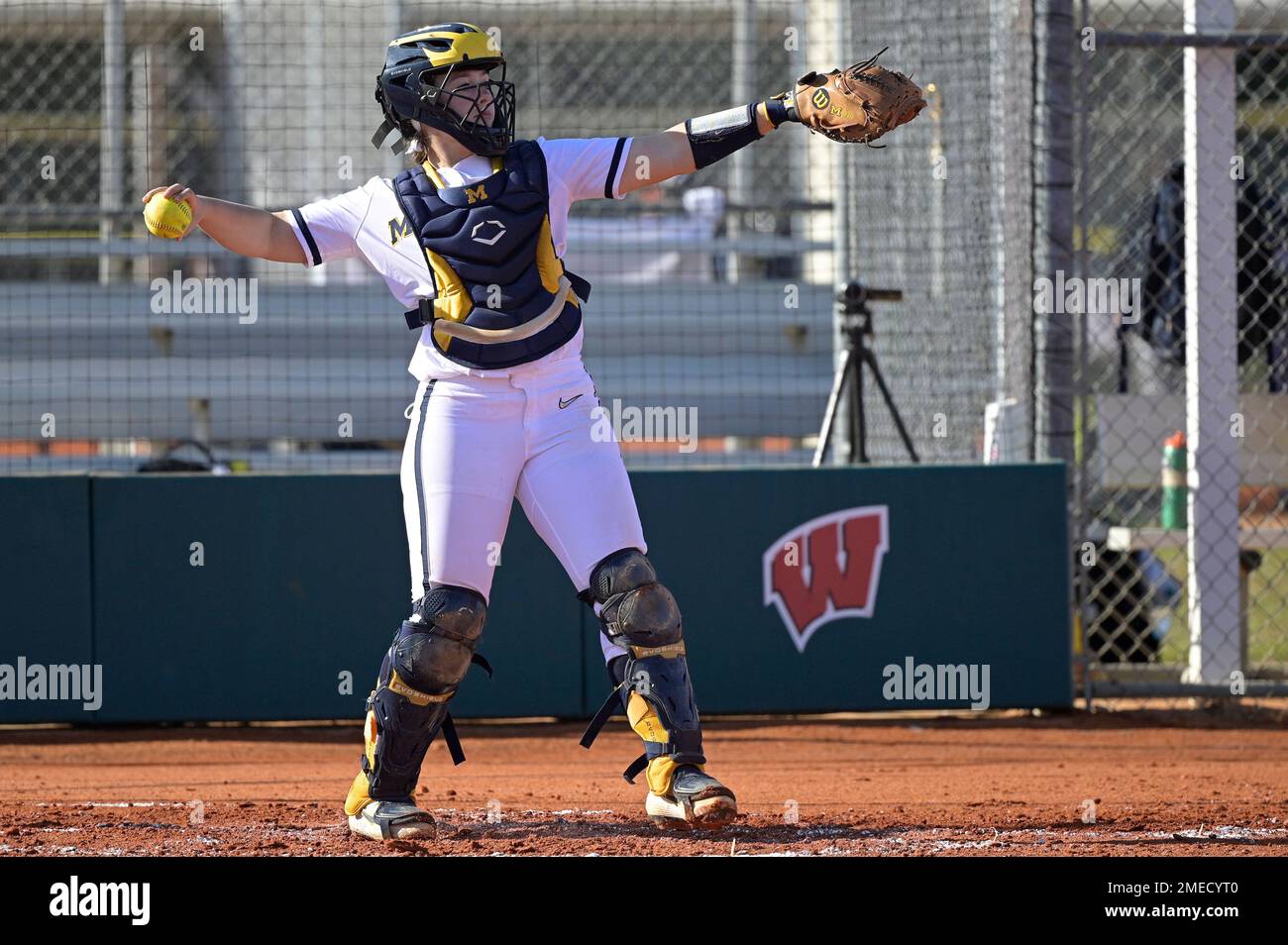 Michigan catcher Hannah Carson throws during an NCAA college softball ...