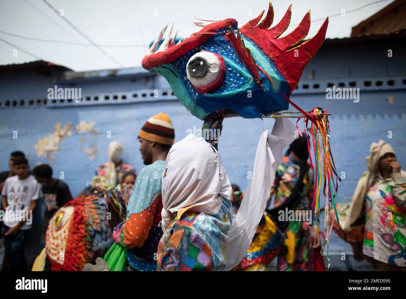 People dressed in devil costumes celebrate the Catholic holiday of ...