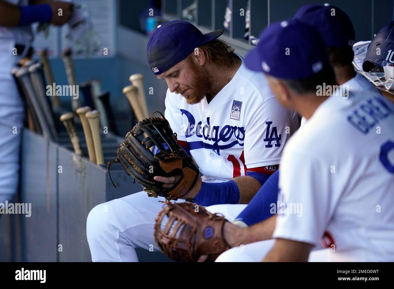 Los Angeles Dodgers third baseman Justin Turner prepares in the dugout ...