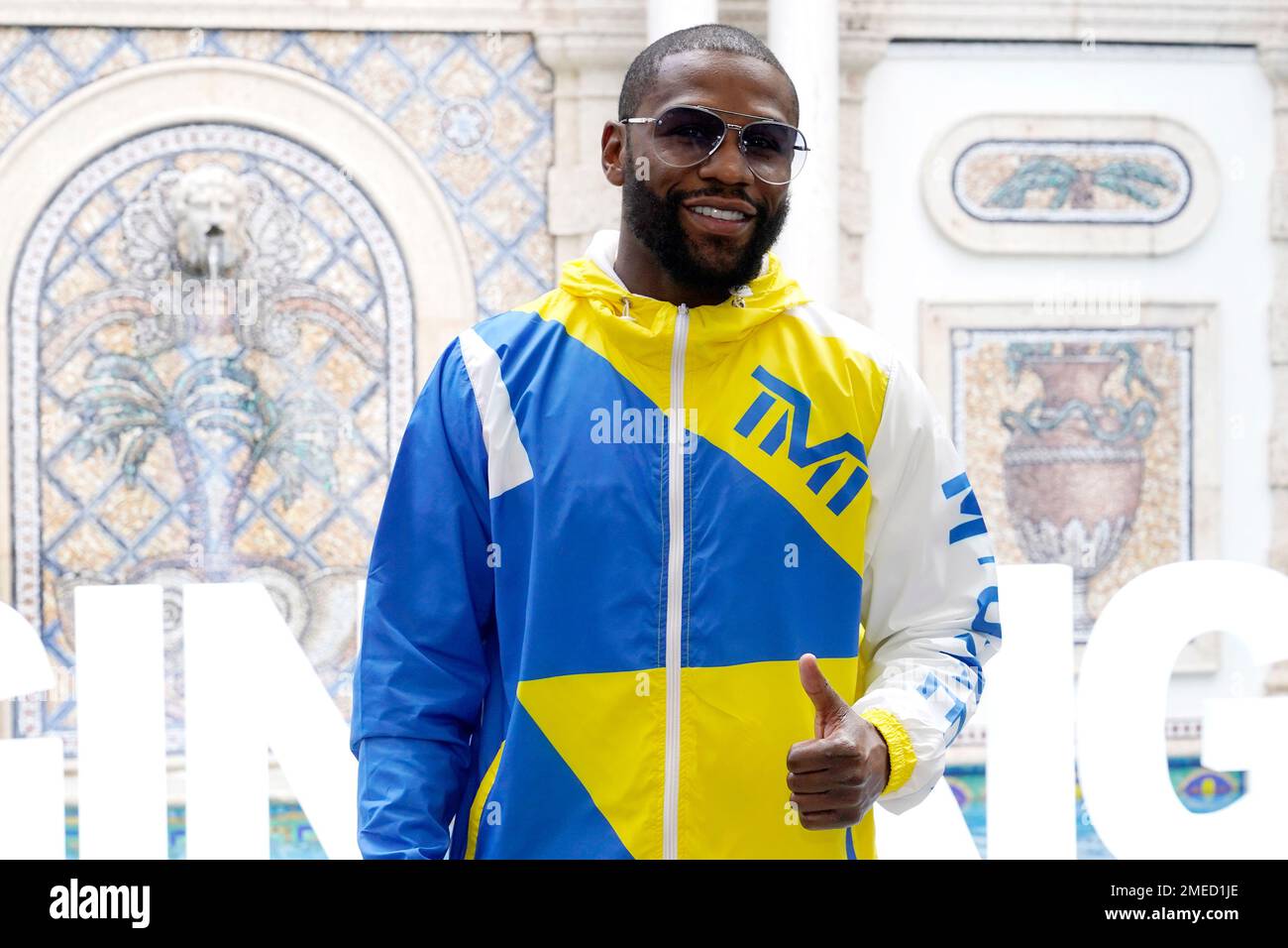 Floyd Mayweather poses for a photograph during a press event, Thursday ...