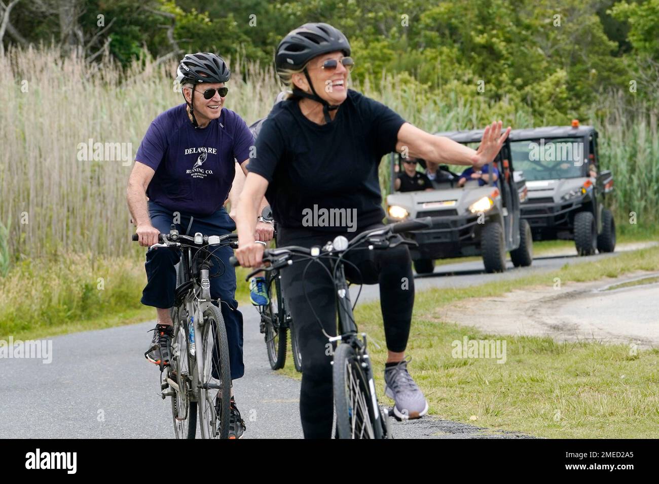 President Joe Biden and first lady Jill Biden take a bike ride in ...